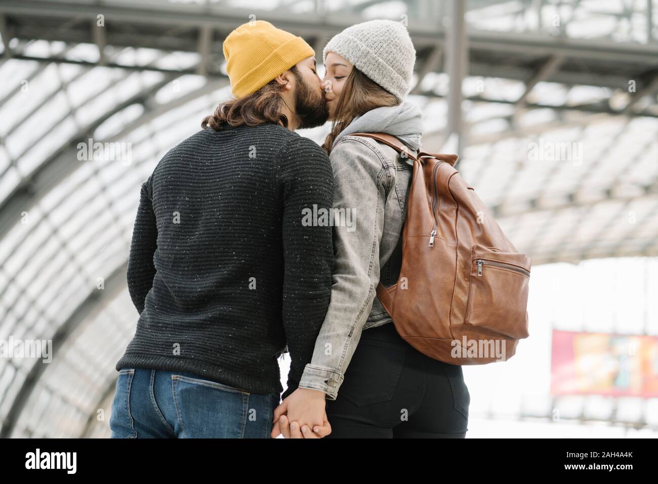 Young couple kissing at the station platform, Berlin, Germany Stock ...