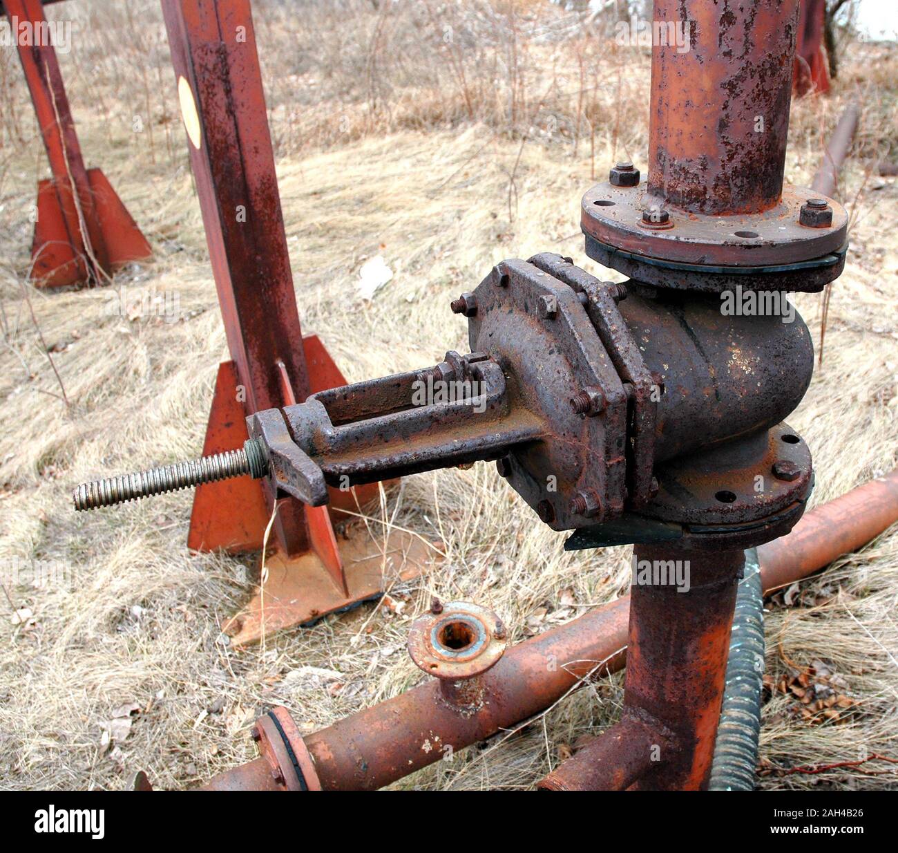 The old rusty water tap crane a latch Stock Photo - Alamy