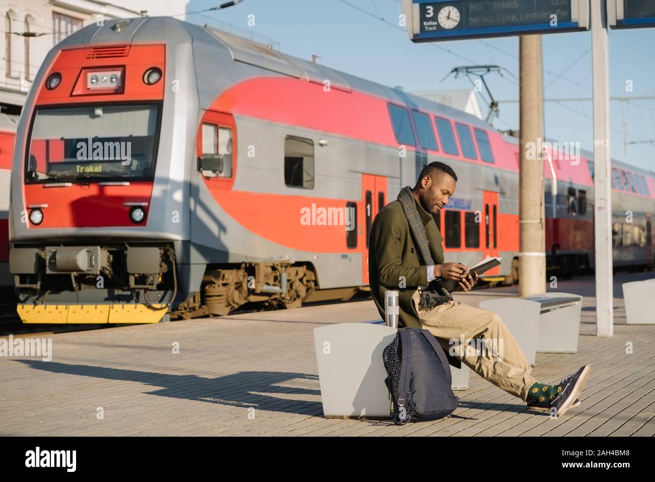 Business person reading paper on train hi-res stock photography and ...