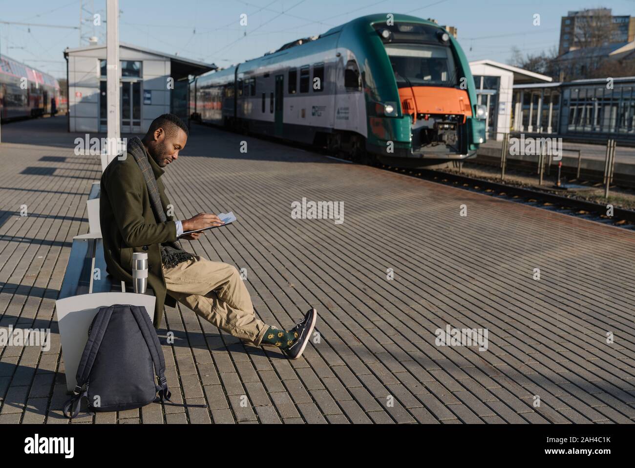 Business person reading paper on train hi-res stock photography and ...