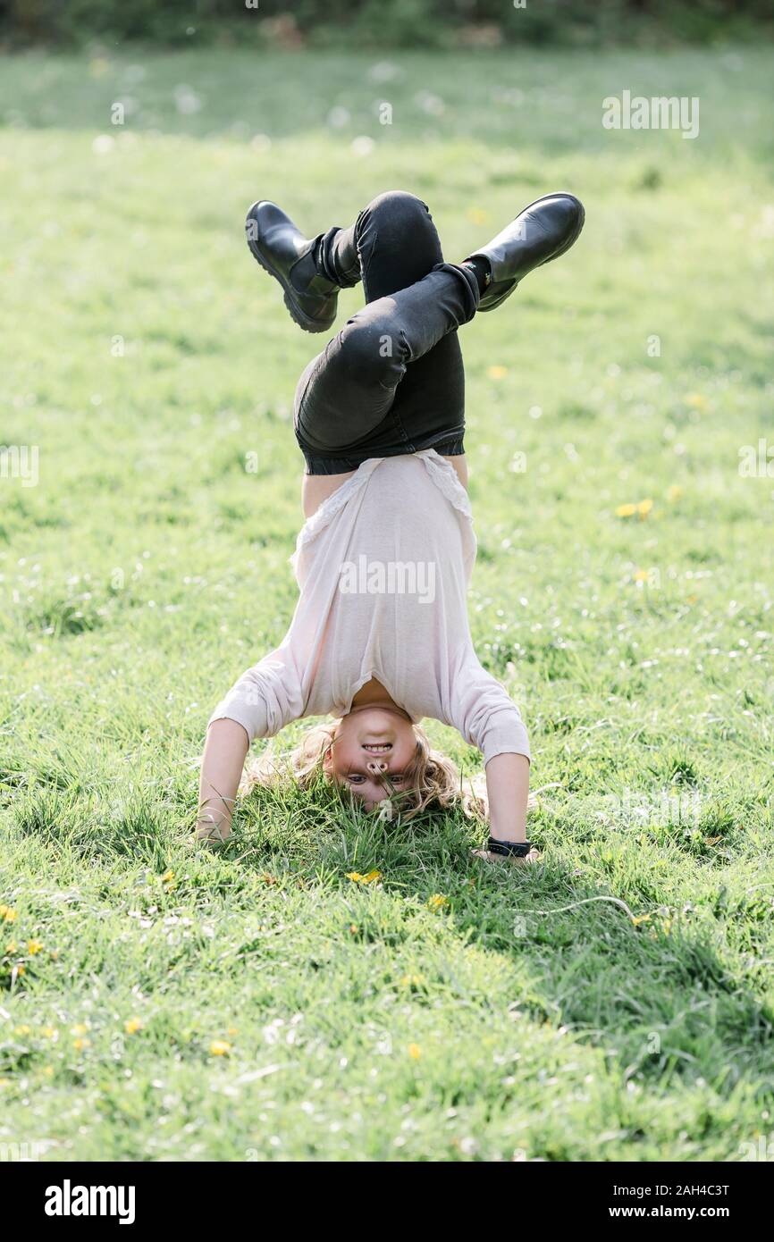 Child doing headstand hi-res stock photography and images - Alamy