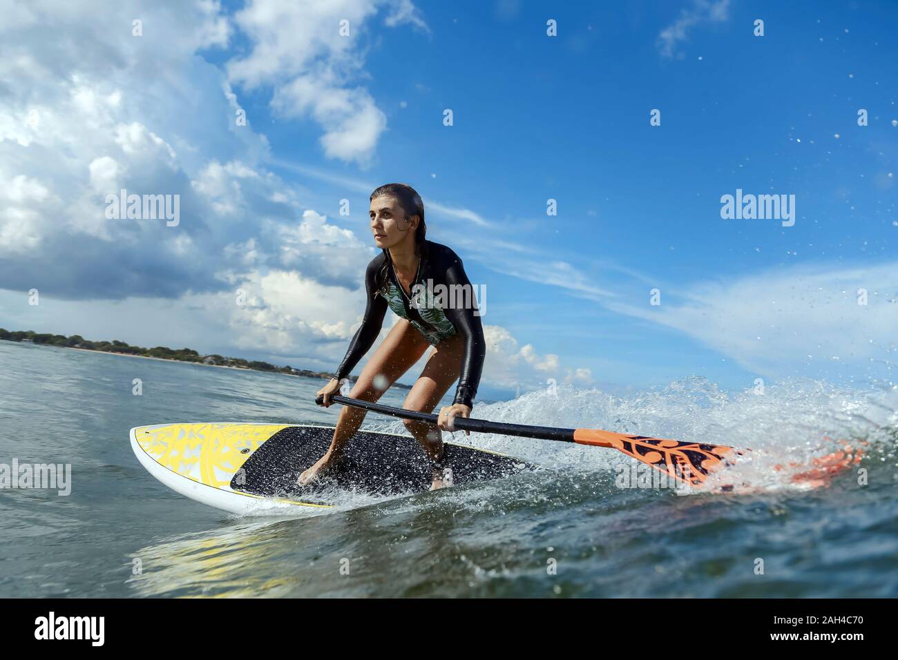 Female SUP surfer, Bali, Indonesia Stock Photo - Alamy