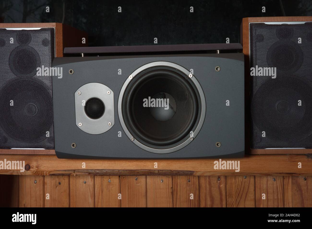 A pair of speakers and subwoofer placed on the window sill Stock Photo ...