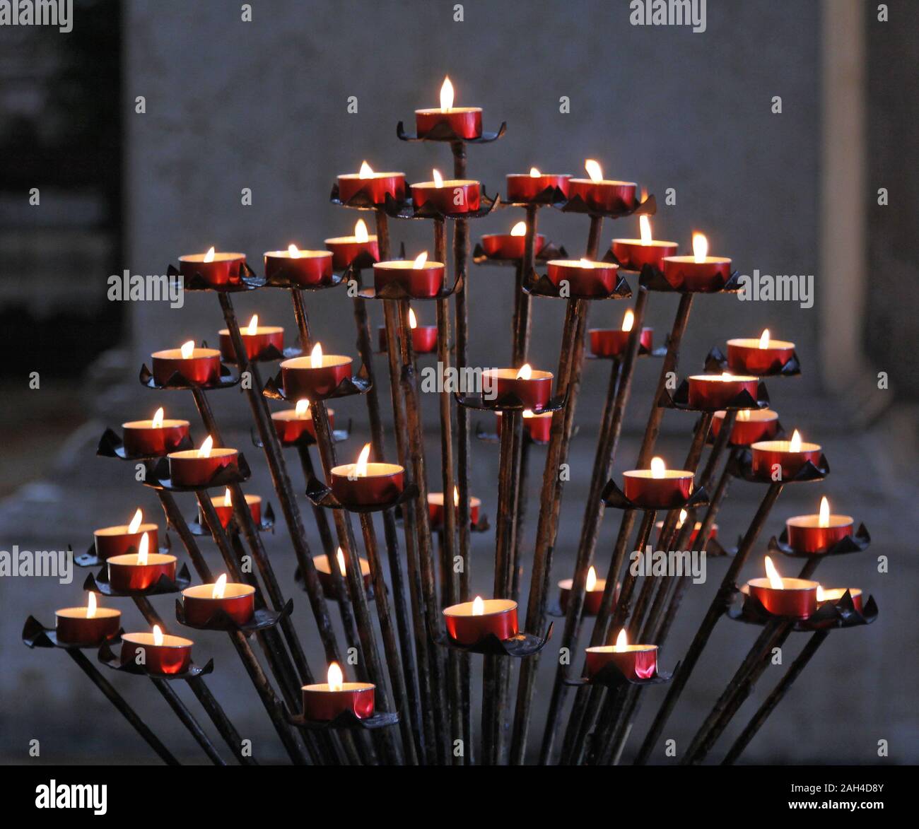 Tree of light from candles in church Stock Photo - Alamy