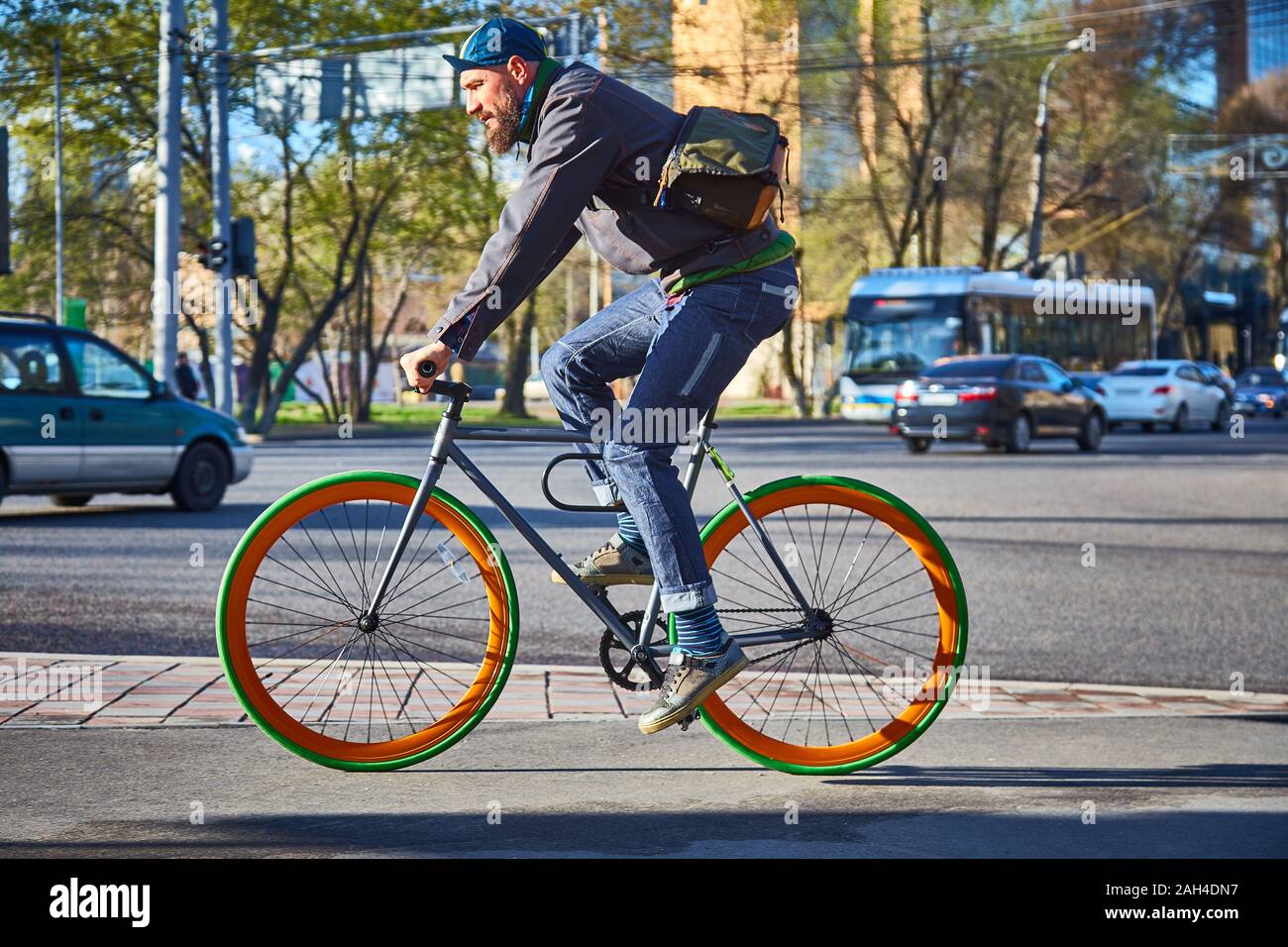 Bicyclist crossing bike lane hi-res stock photography and images - Alamy