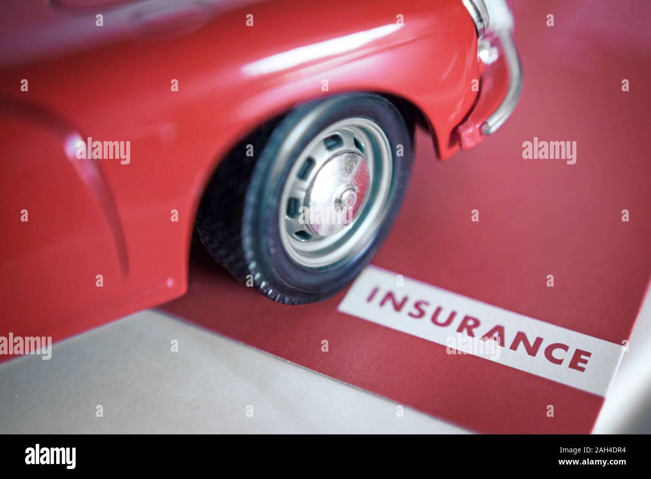 The front wheel of the car on the insurance flyer Stock Photo - Alamy