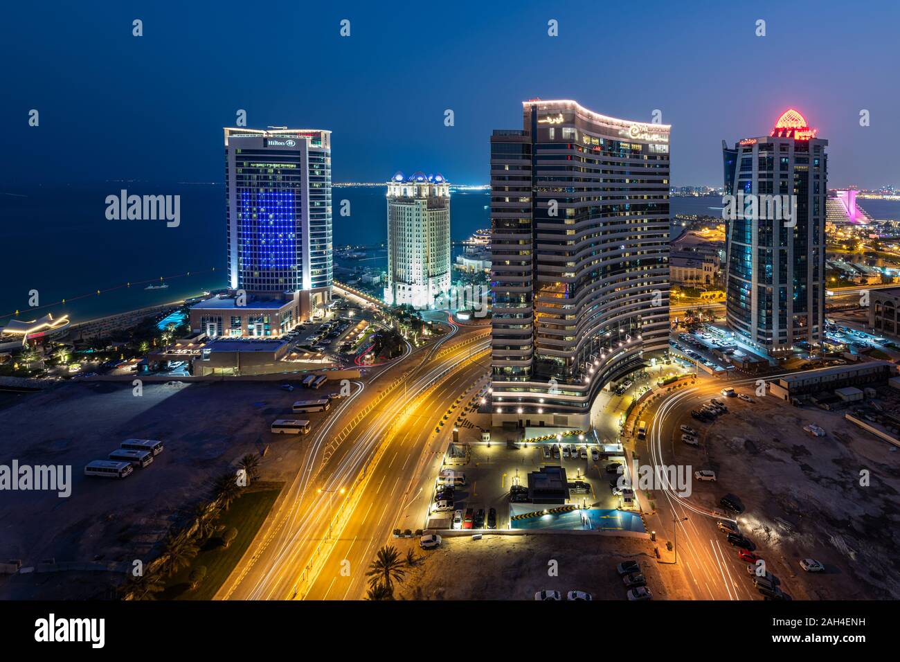 Doha Skyline, Curve and Hilton Hotel in Qatar Stock Photo - Alamy