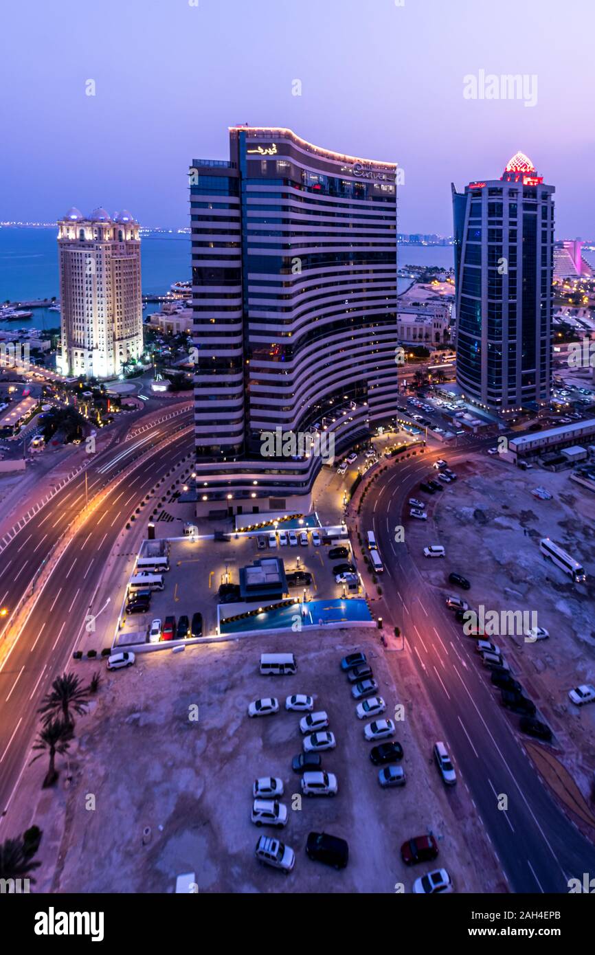 Doha Skyline, Curve and Hilton Hotel in Qatar Stock Photo - Alamy