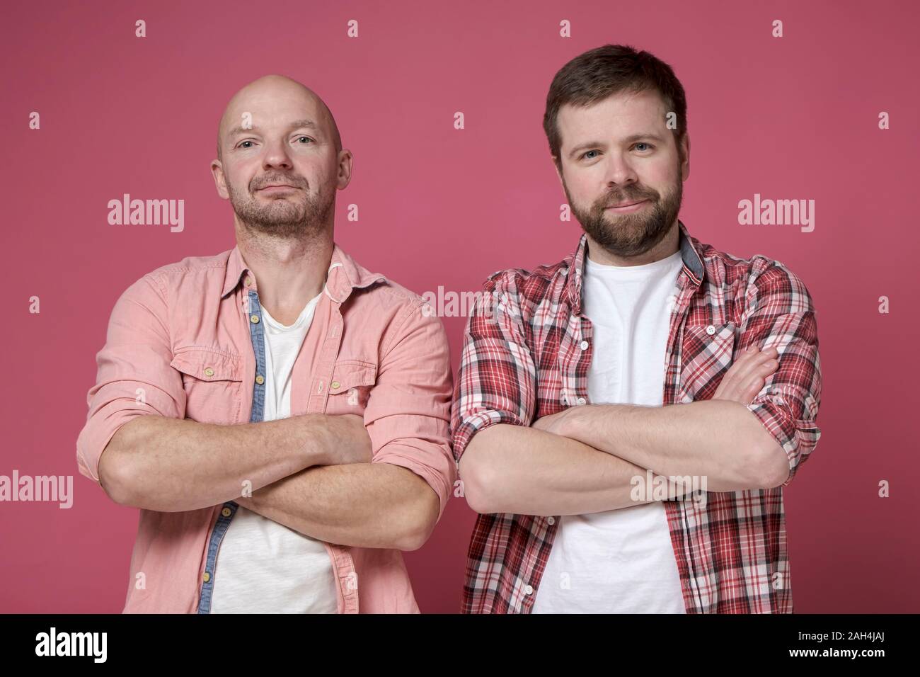 Two men standing with arms crossed hi-res stock photography and images ...