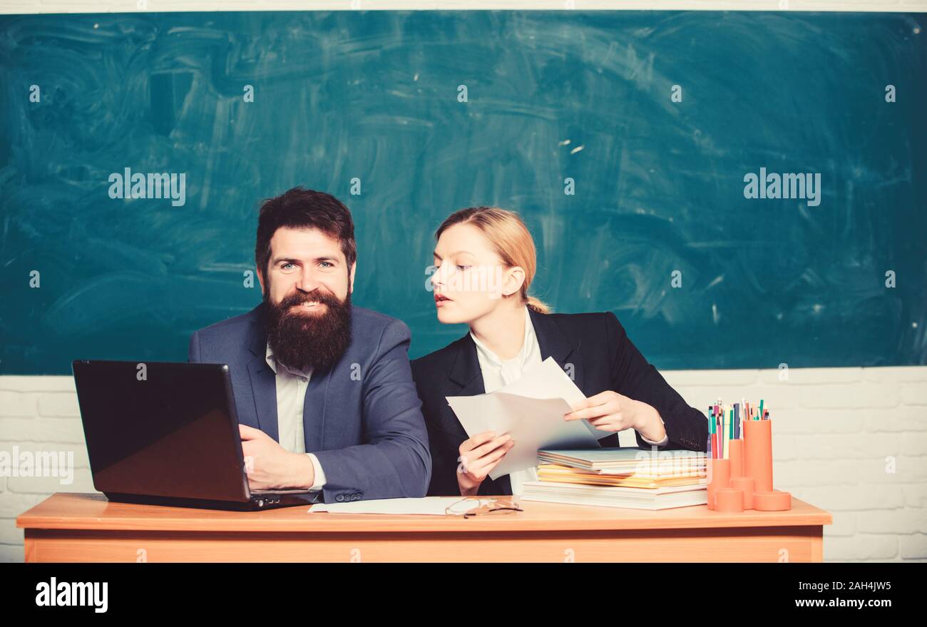 School educator with laptop and principal with documents. School ...