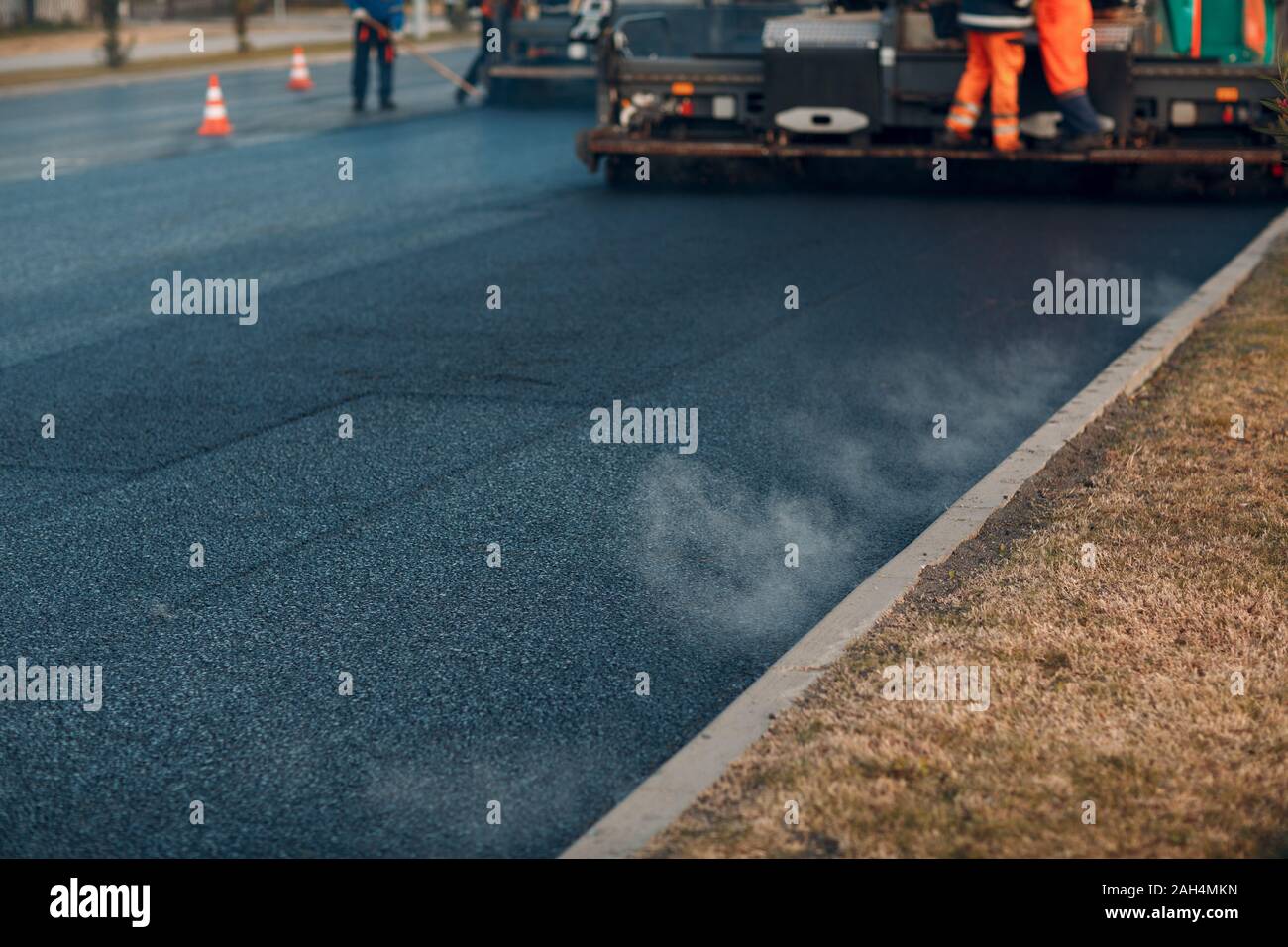 Asphalt paving. Paver machine and road roller. New road construction ...