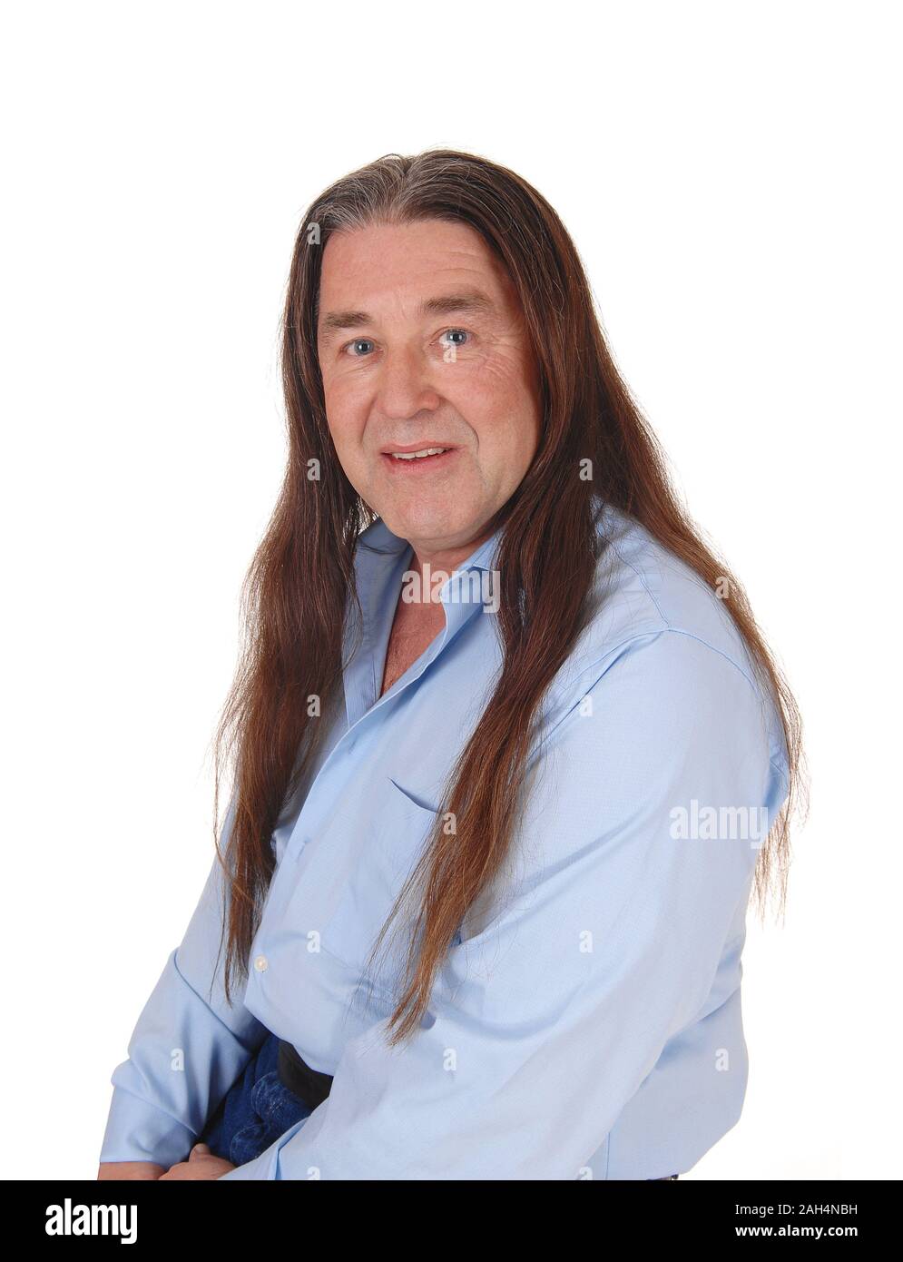 A handsome indigenous man smiling in a portrait shoot with his long ...