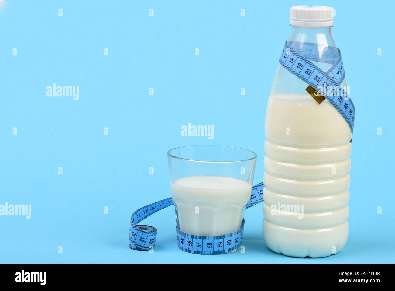 Calcium nutrition and healthy diet. Milk in transparent containers ...