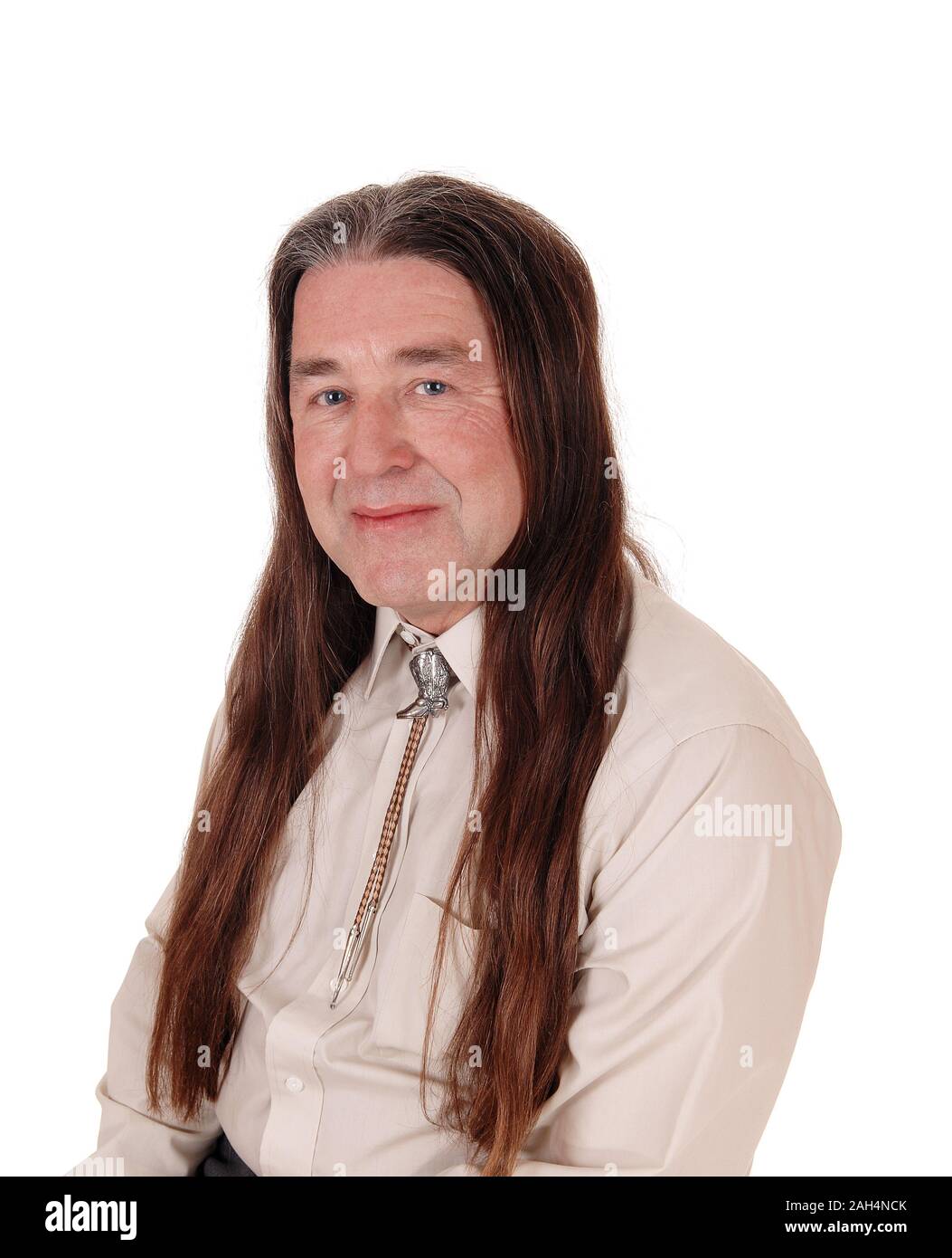 A handsome indigenous man smiling in a portrait shoot with his long ...