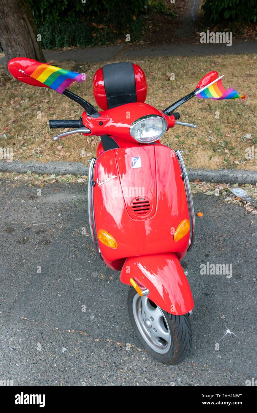 red moped scooter with rainbow flags in Seattle Washington State USA ...