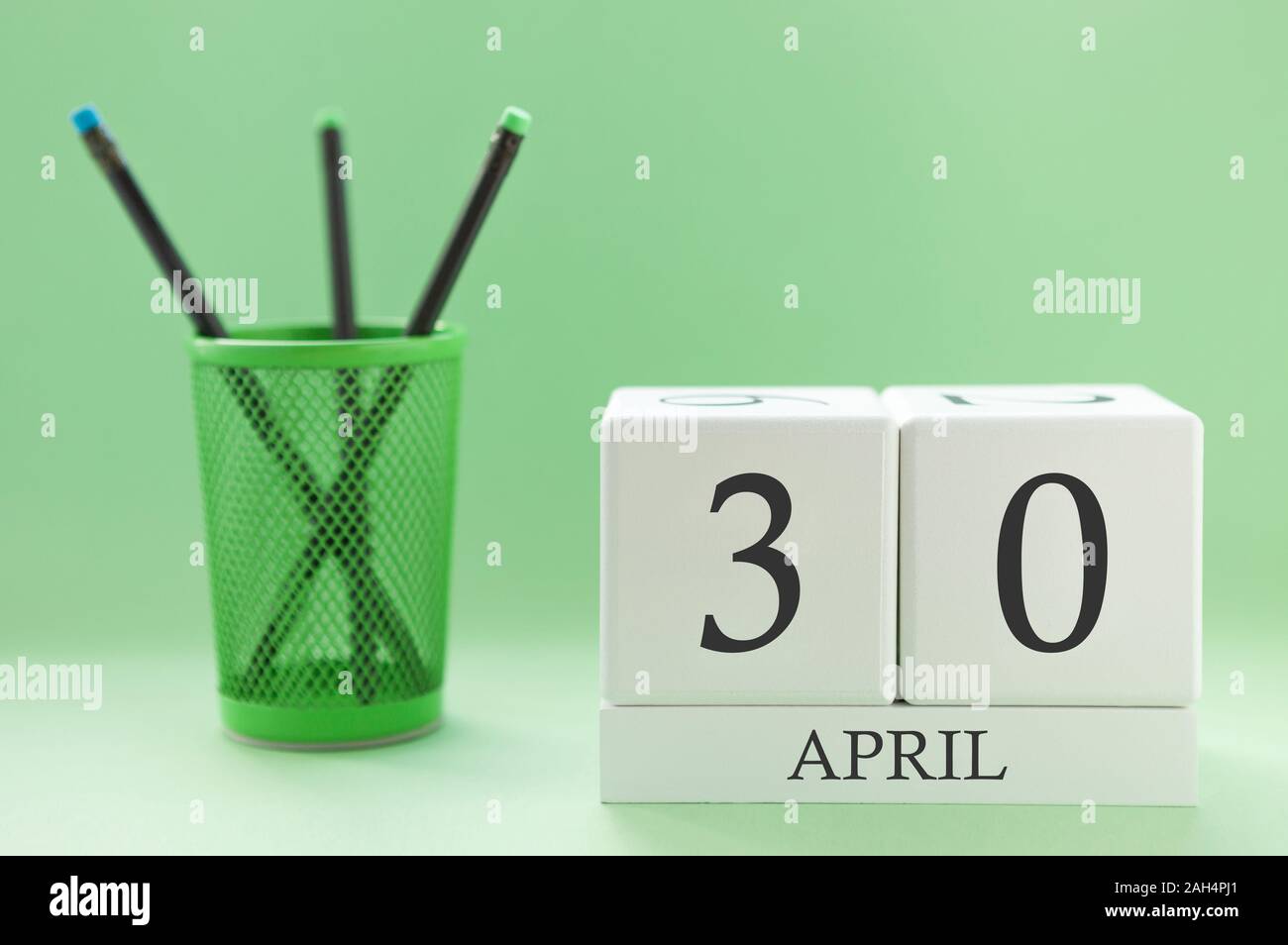 Desk calendar of two cubes for April 30 Stock Photo - Alamy