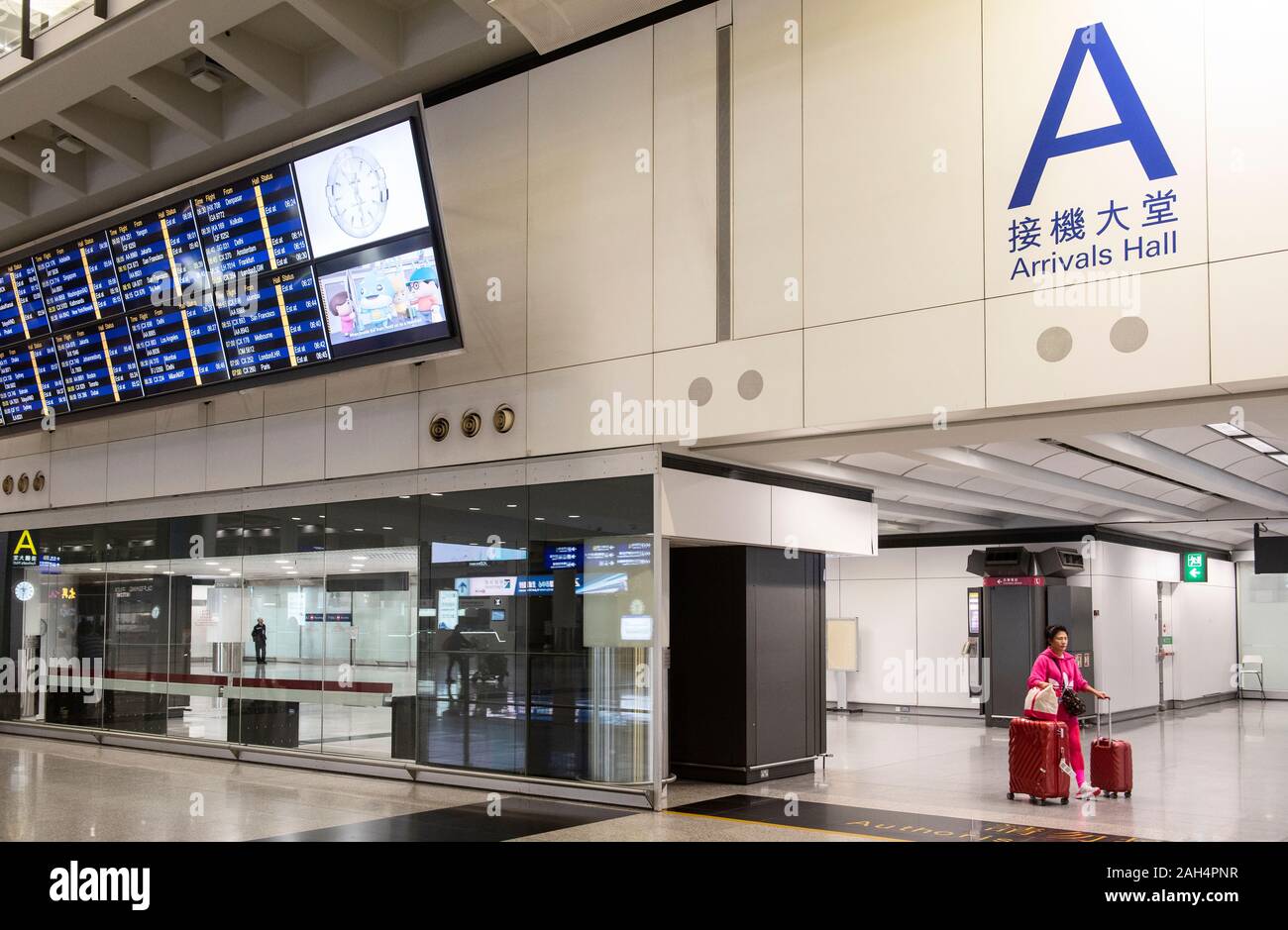 A passenger enters at the arrival hall at Hong Kong international ...