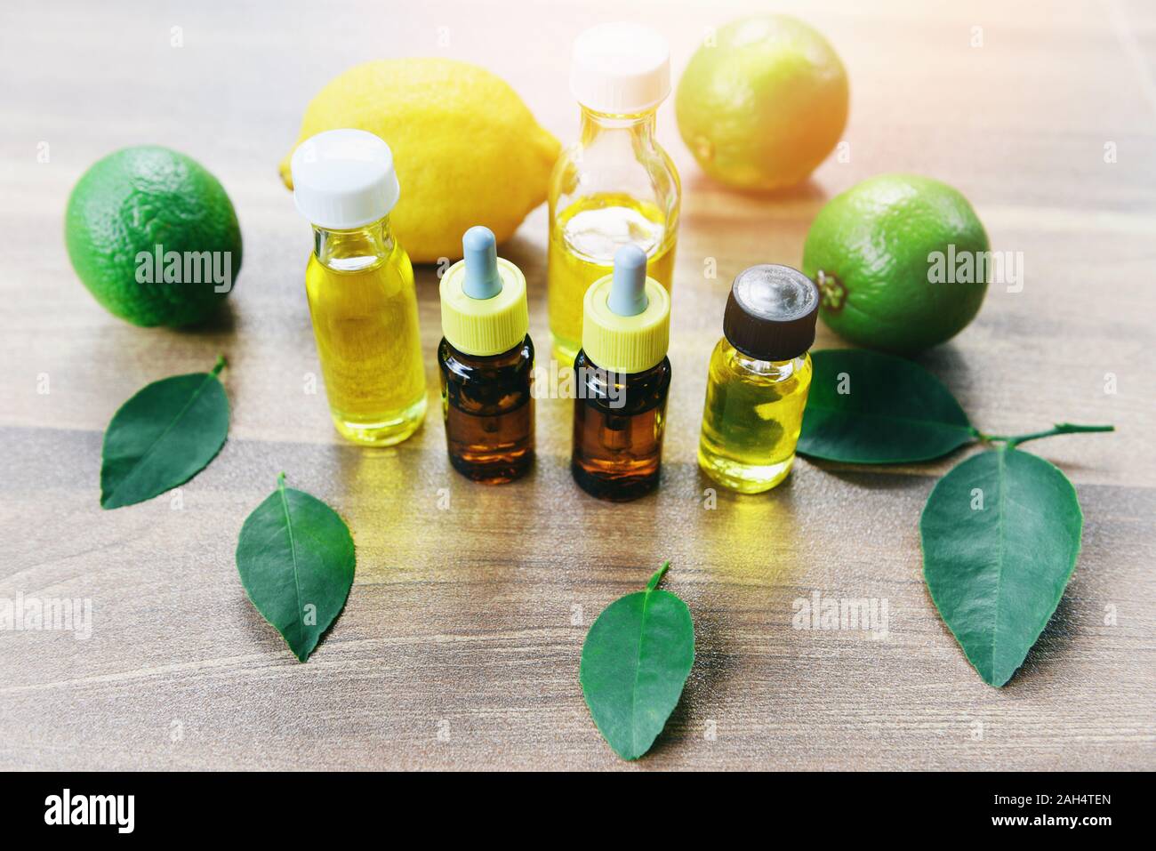 Aromatherapy herbal oil bottles aroma with lemon and lime leaves herbal ...