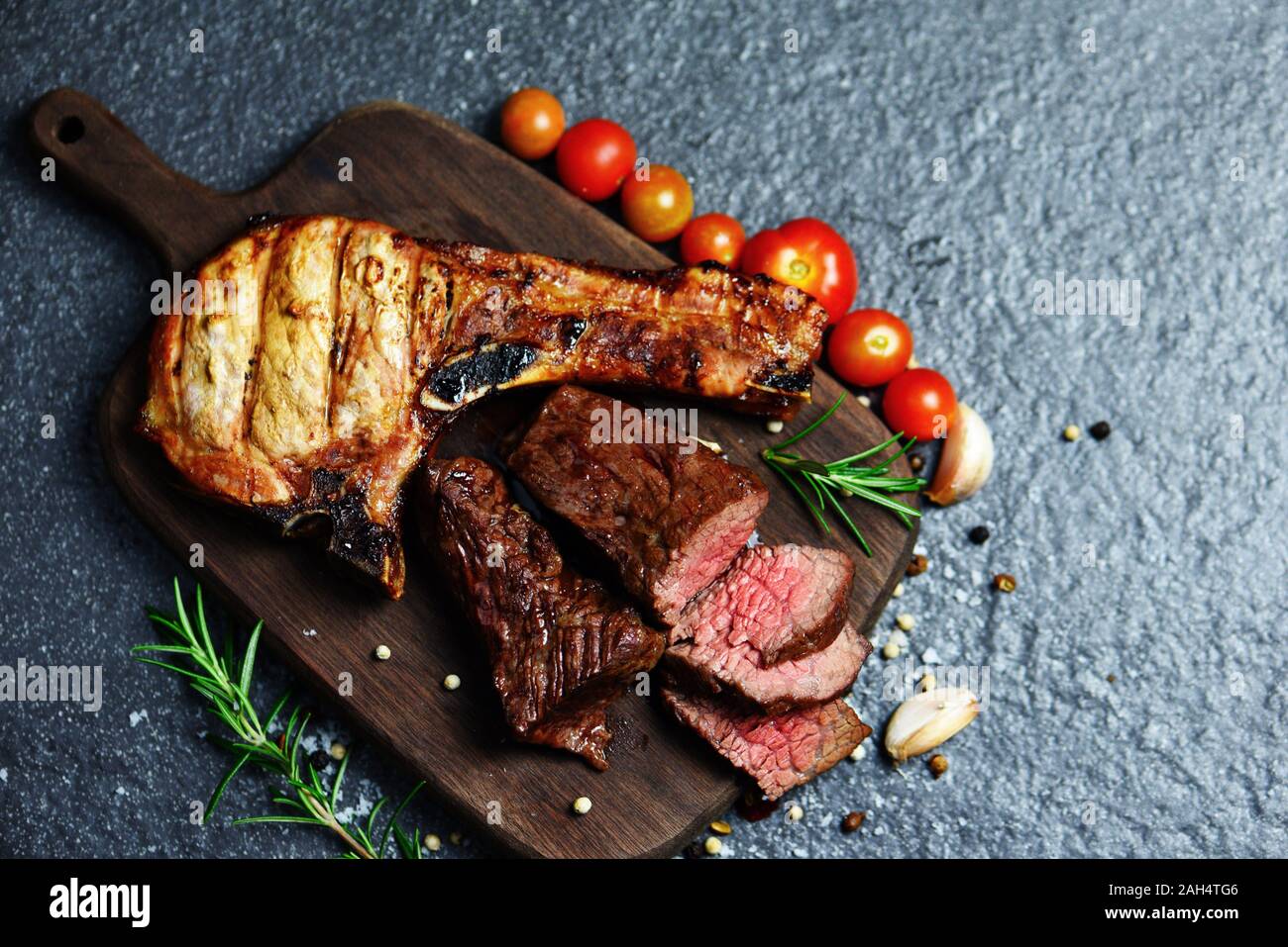Grilled beef meat slice on black background / Roasted beef steak fillet ...