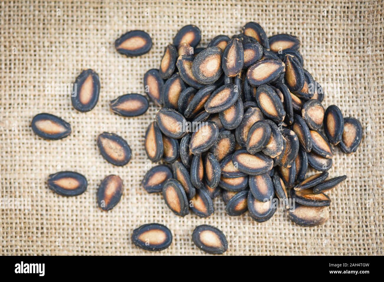 watermelon seeds on sack / close up dried watermelon seed with salt for ...