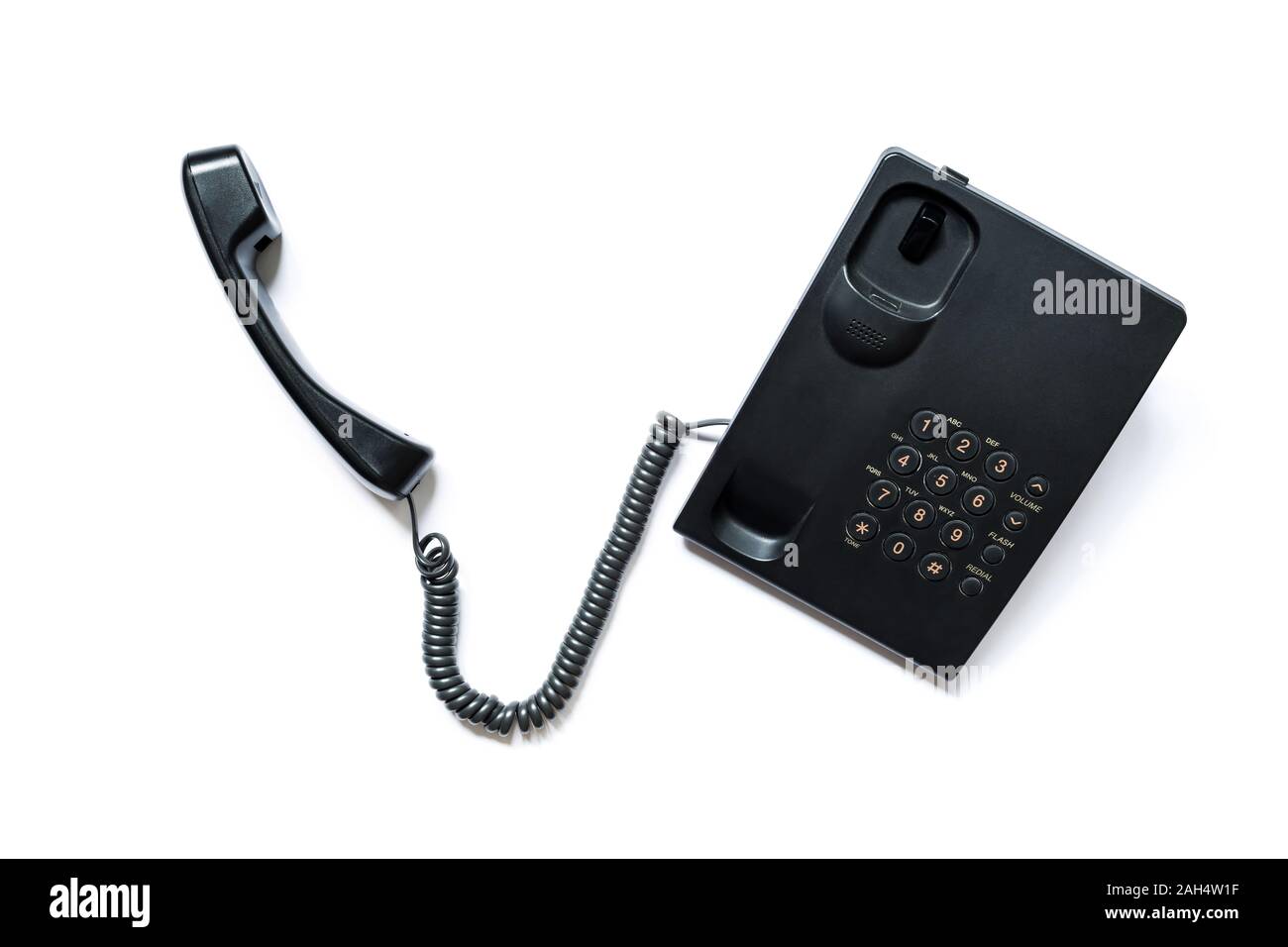 Simple modern push-button telephone of black color with a picked up ...
