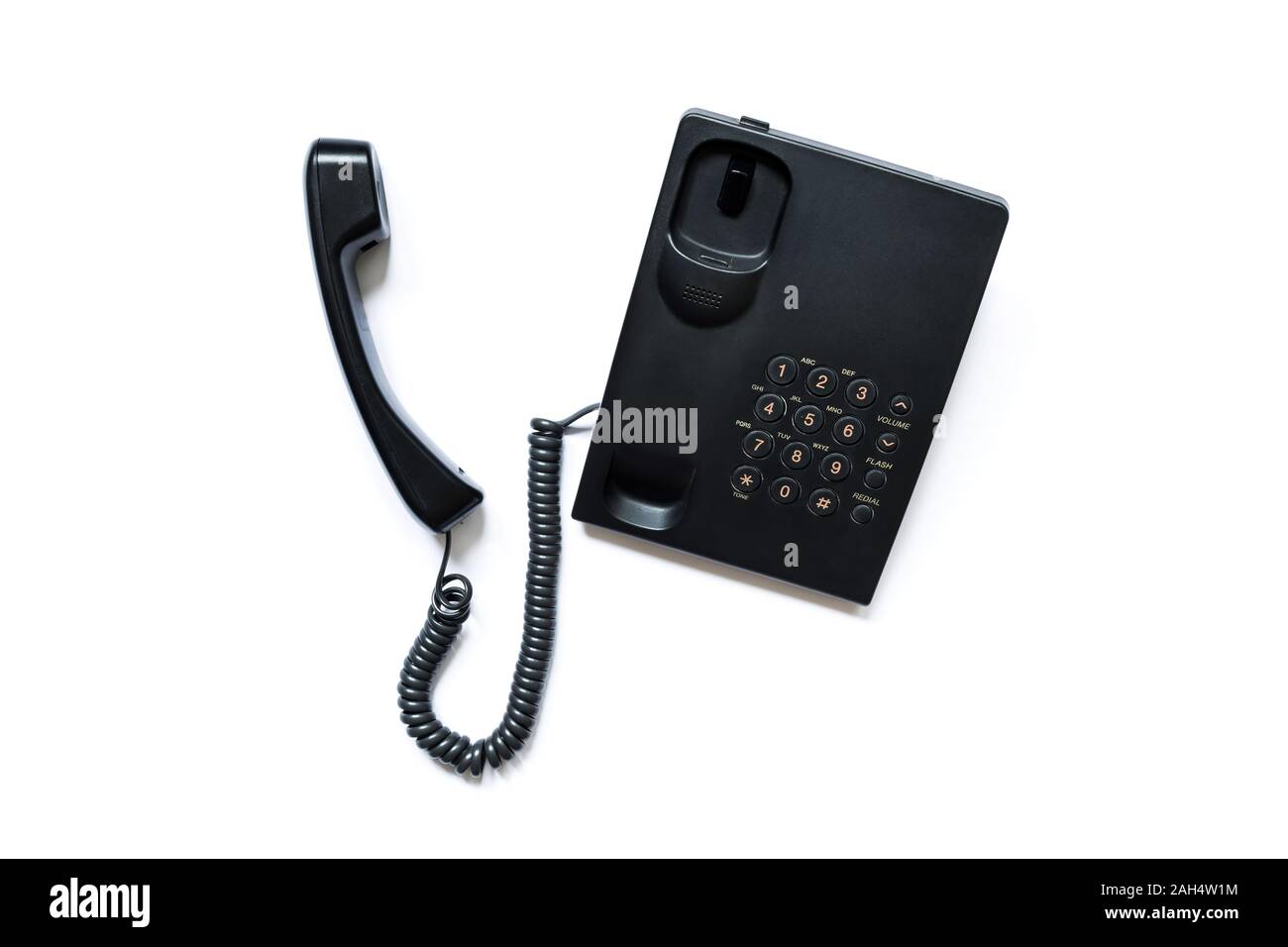 Simple modern push-button telephone of black color with a picked up ...