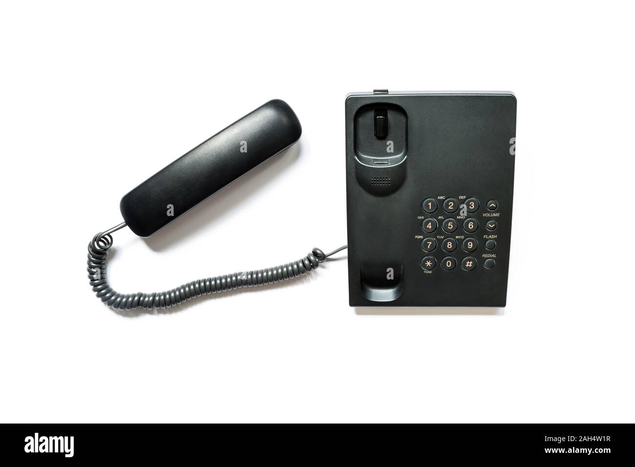 Simple modern push-button telephone of black color with a picked up ...