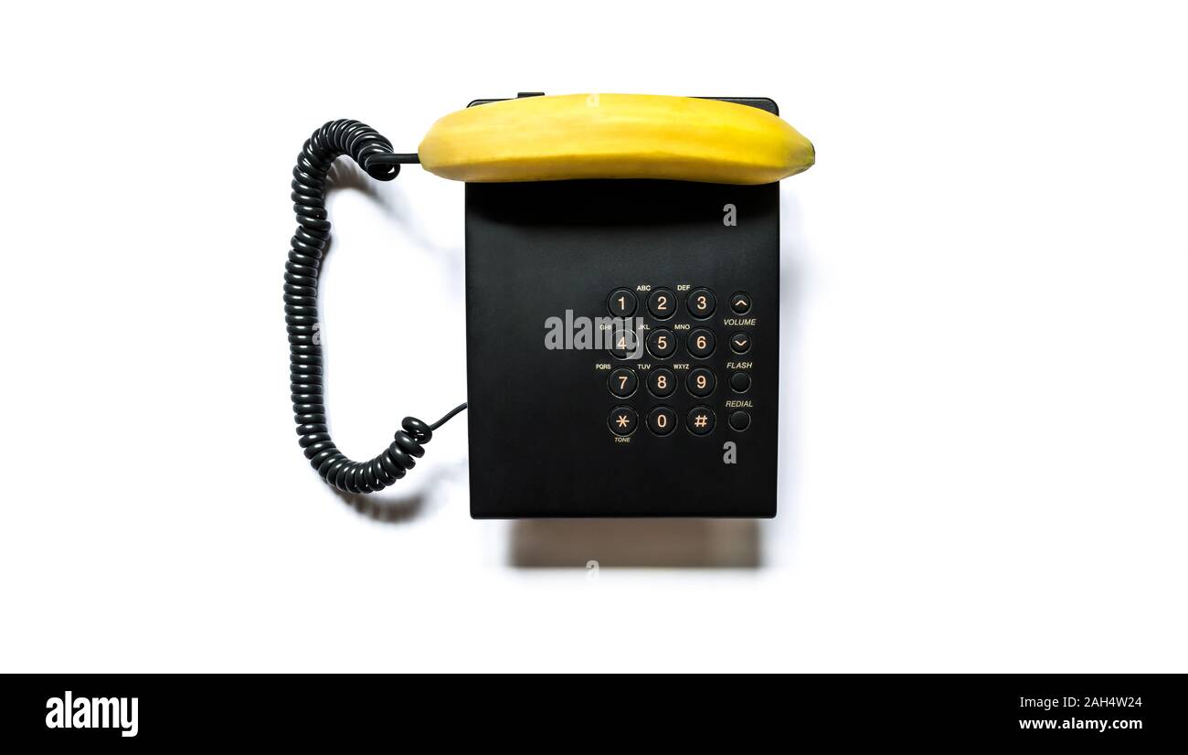 Creative photo of a simple modern black push-button telephone with a ...