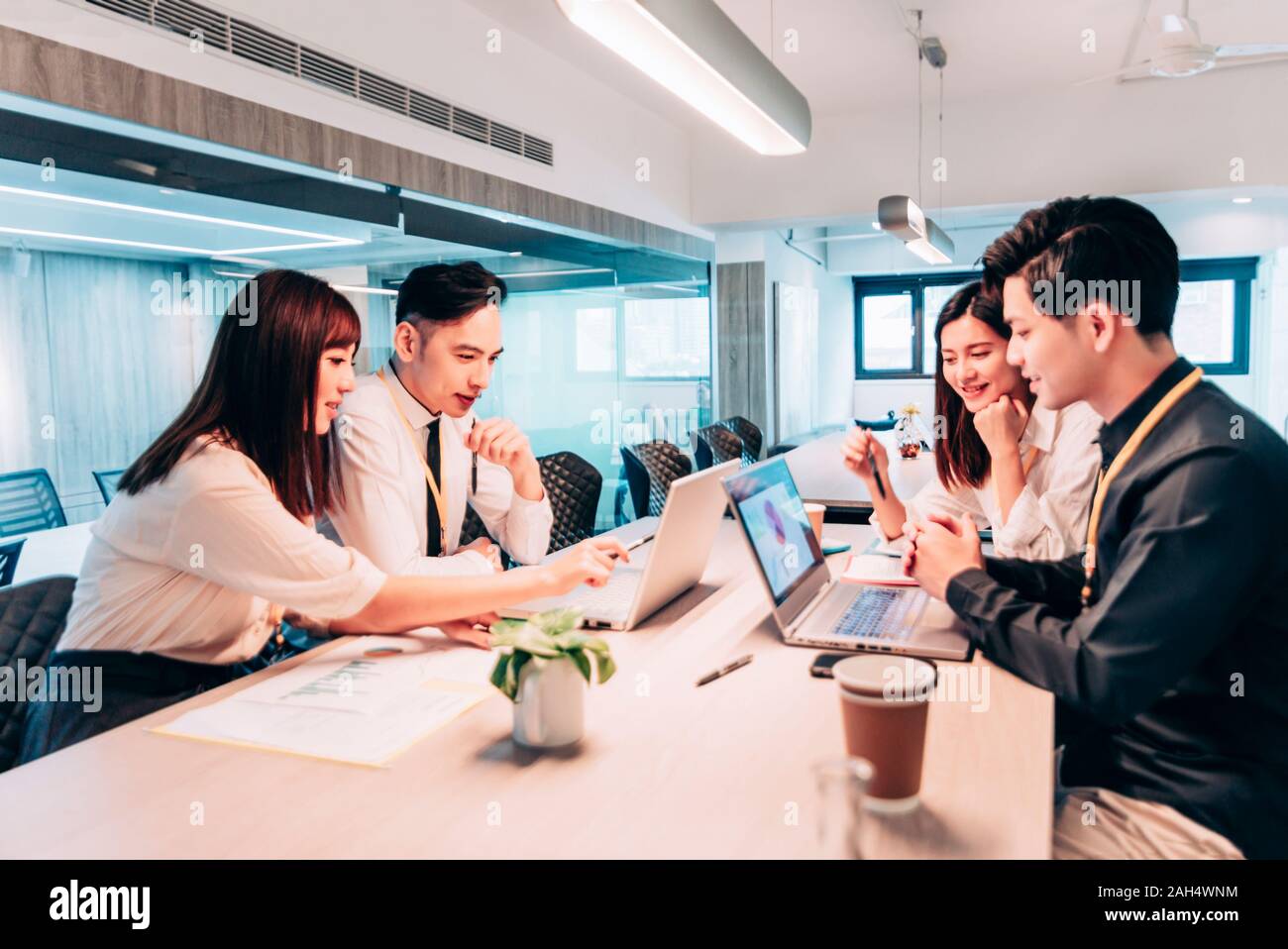 asian young Business people working in office Stock Photo - Alamy