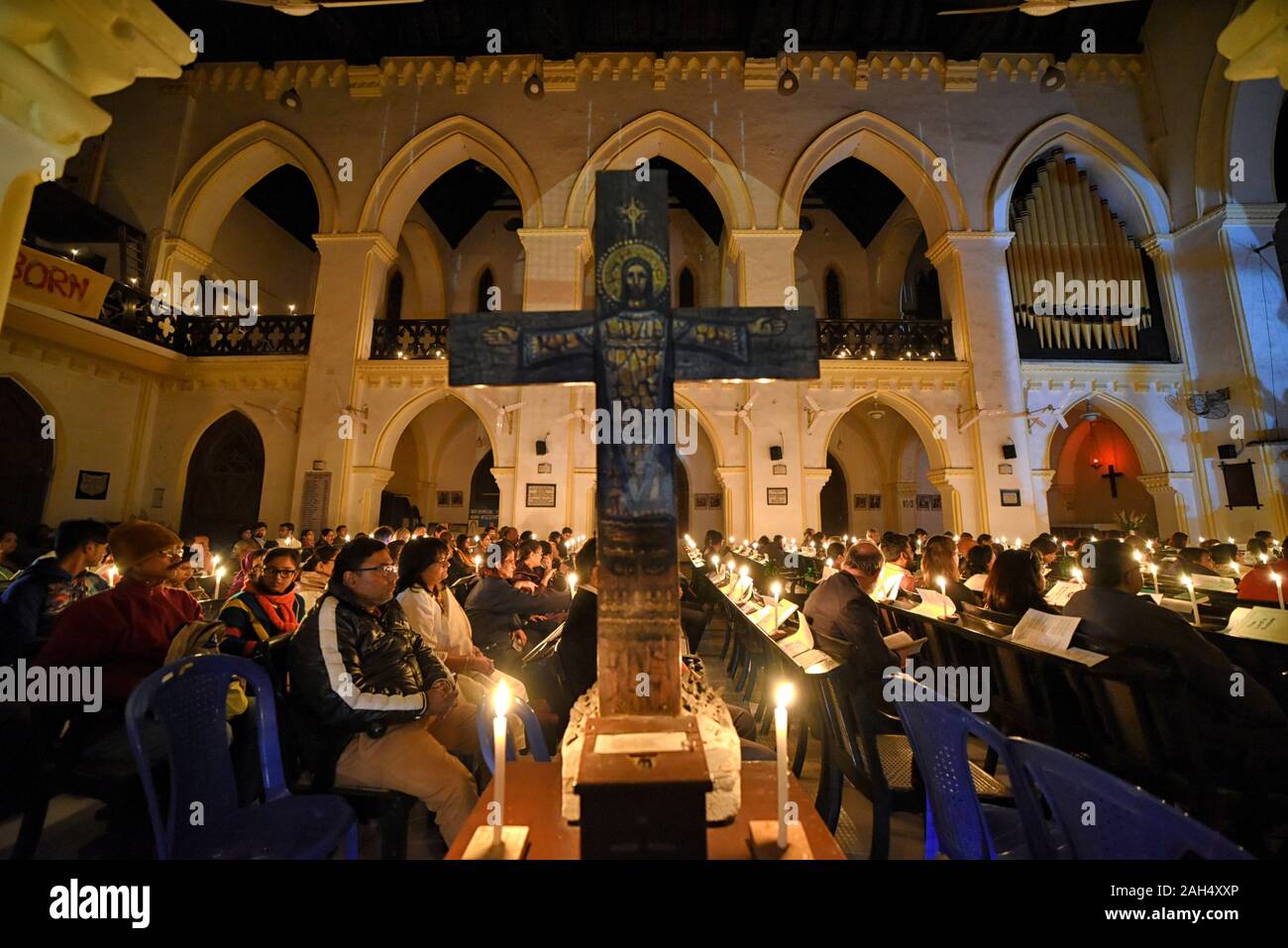 Christian devotees during Mass.Midnight Mass Prayers with Candles on ...