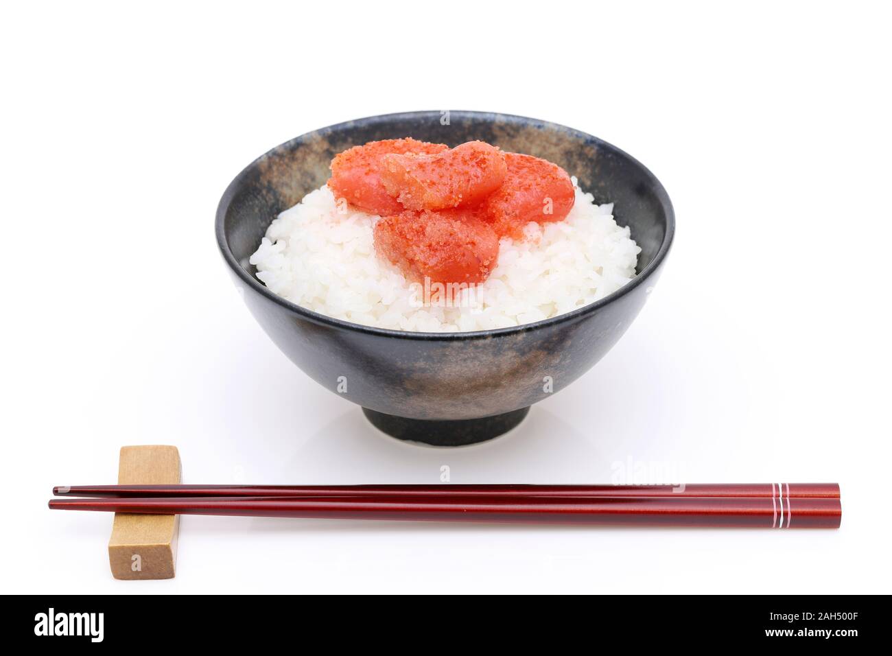 Japanese cooked white rice with karashi mentaiko on white background ...