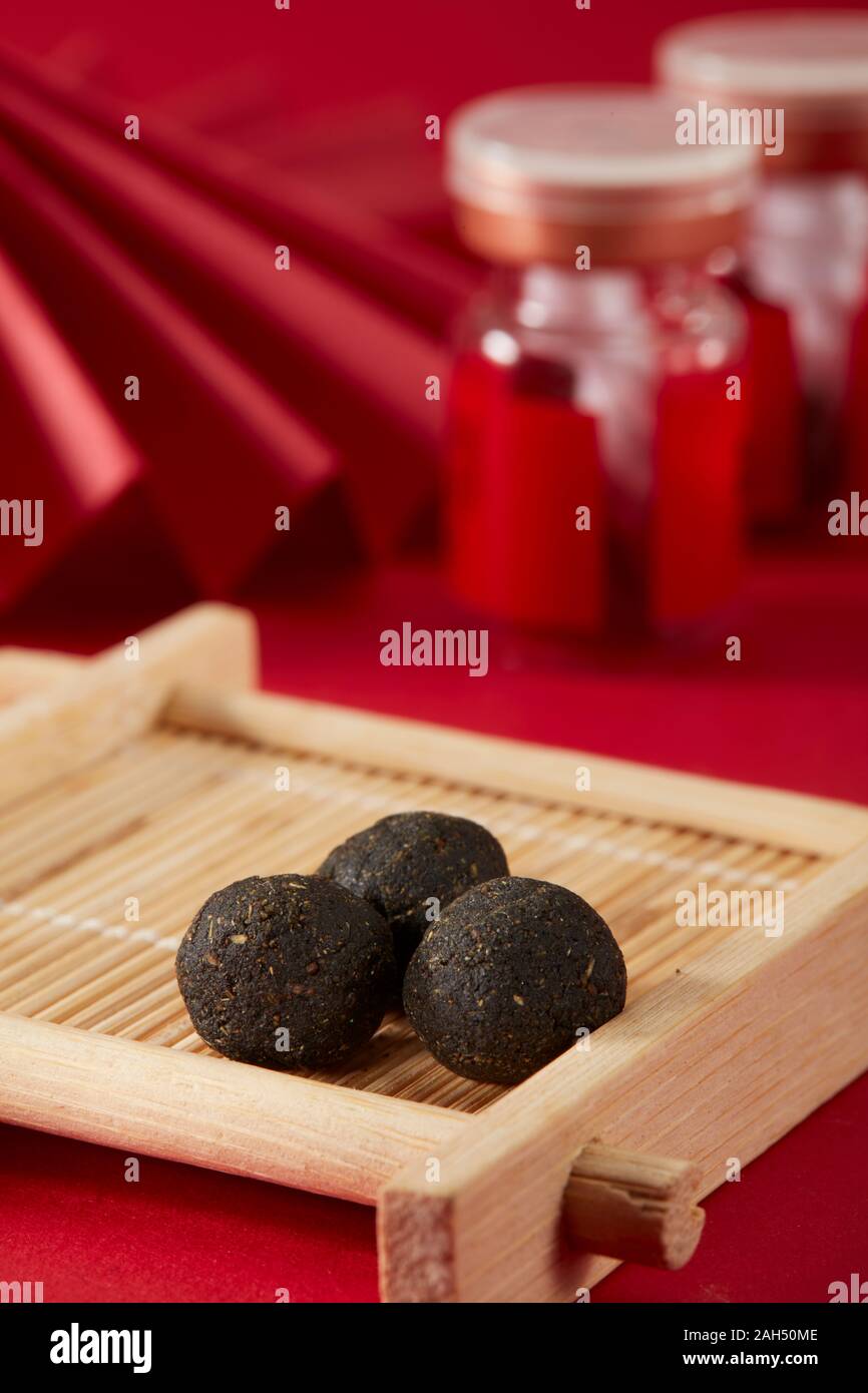 Chinese style red background with red folding fan and red pill bottle ...