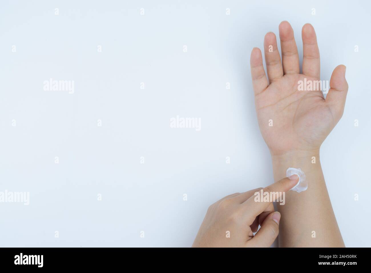 Closeup woman apply pain relief cream on her wrist. Health care and ...