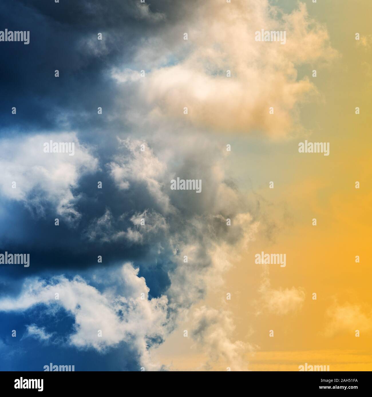 Amazing view of dramatic blue thunderclouds and stunning yellow-golden ...