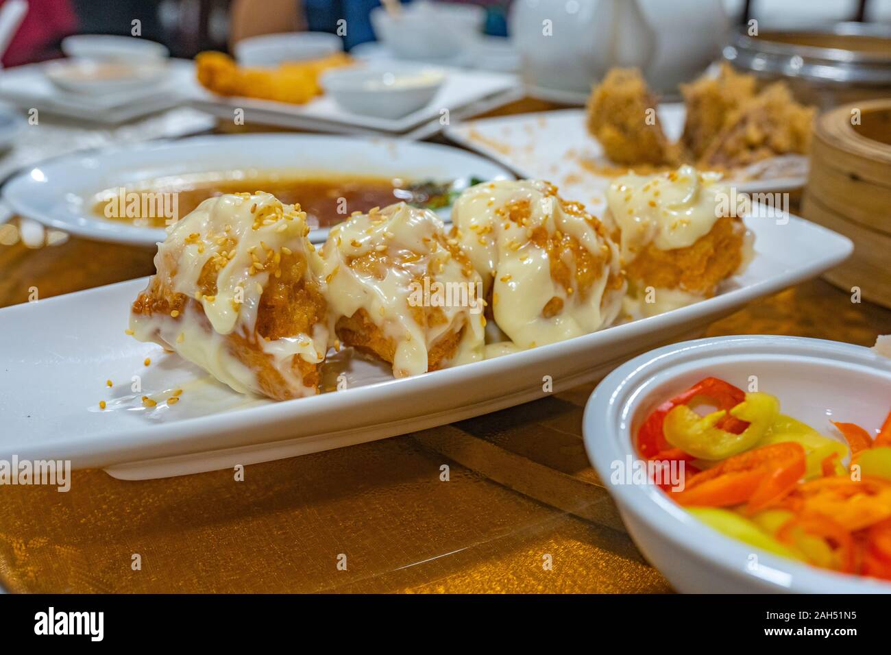 Crispy deep-fried shrimps topped with cheesy mayonnaise Stock Photo - Alamy