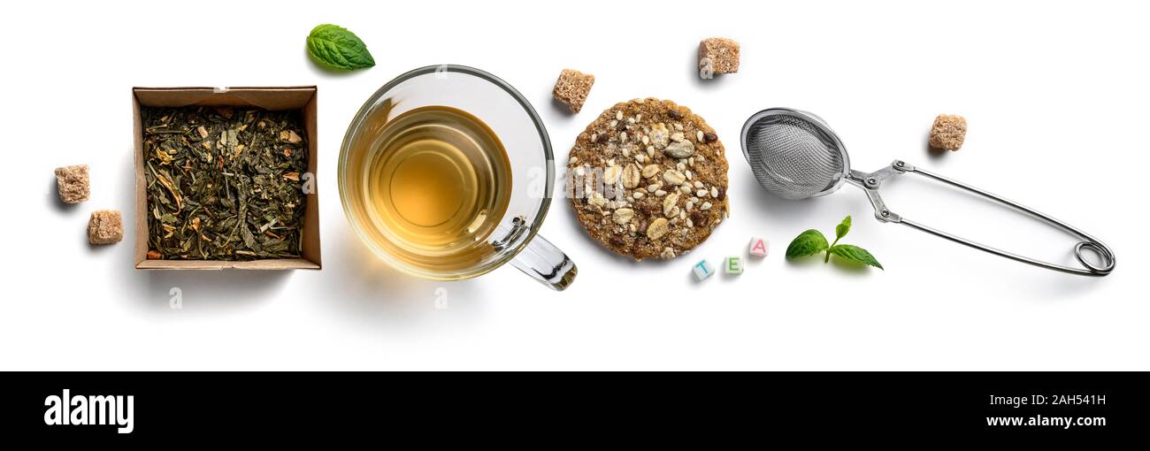 Green tea with natural aromatic additives and accessories. Top view on ...