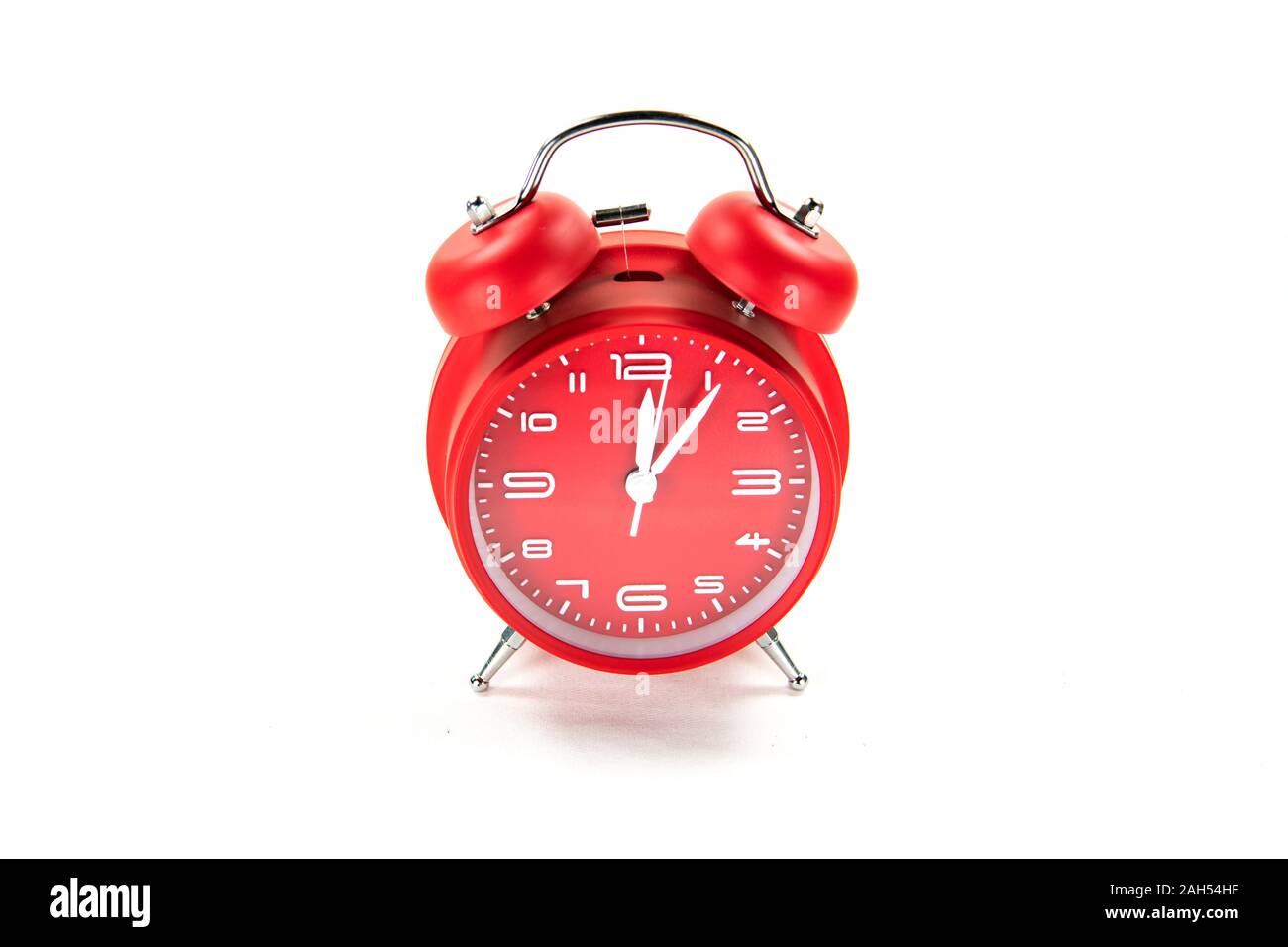 Vintage table clock with bell, red color, isolated on white bacground ...