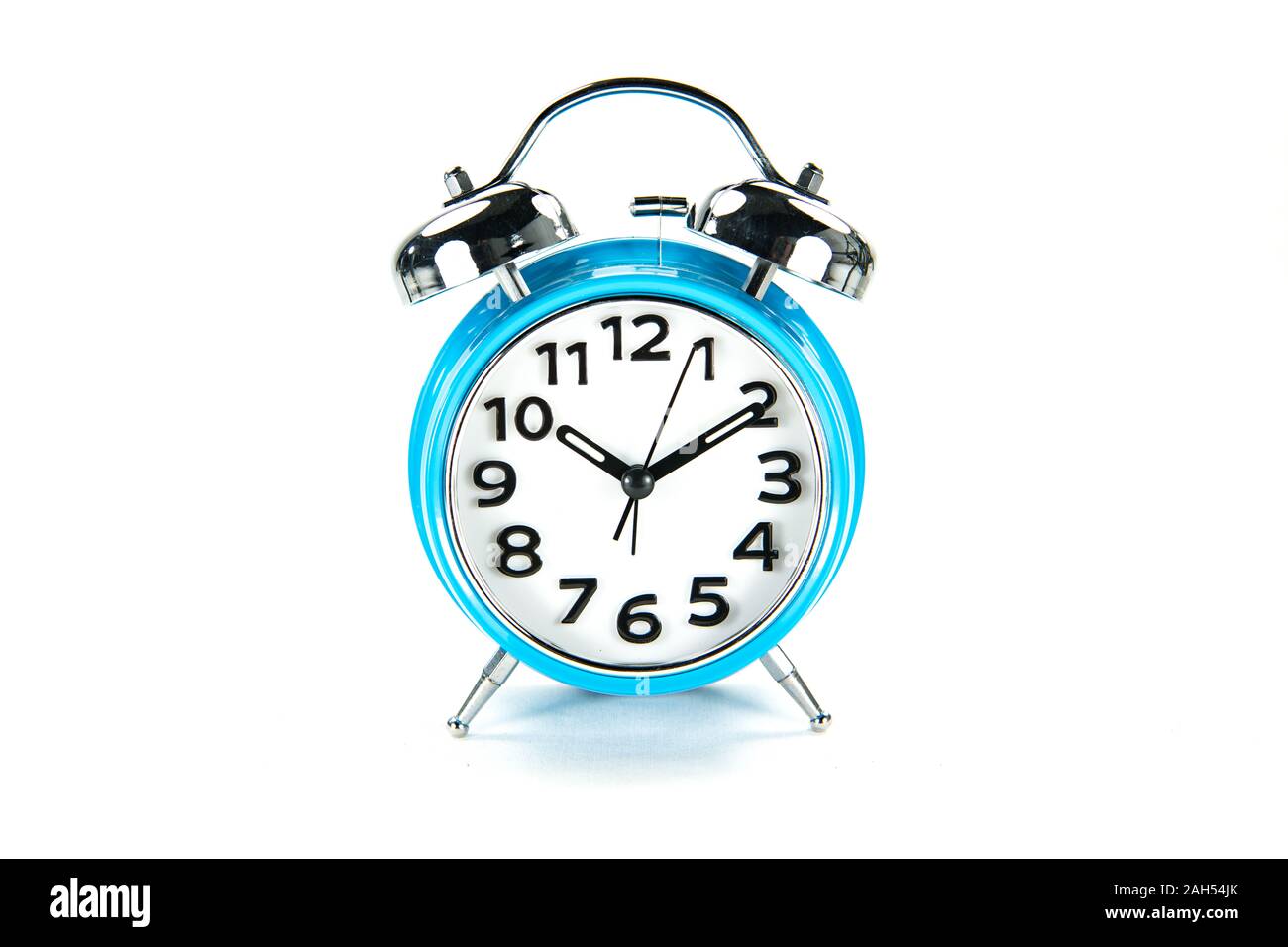 Vintage table clock with bell, light blue color, isolated on white ...