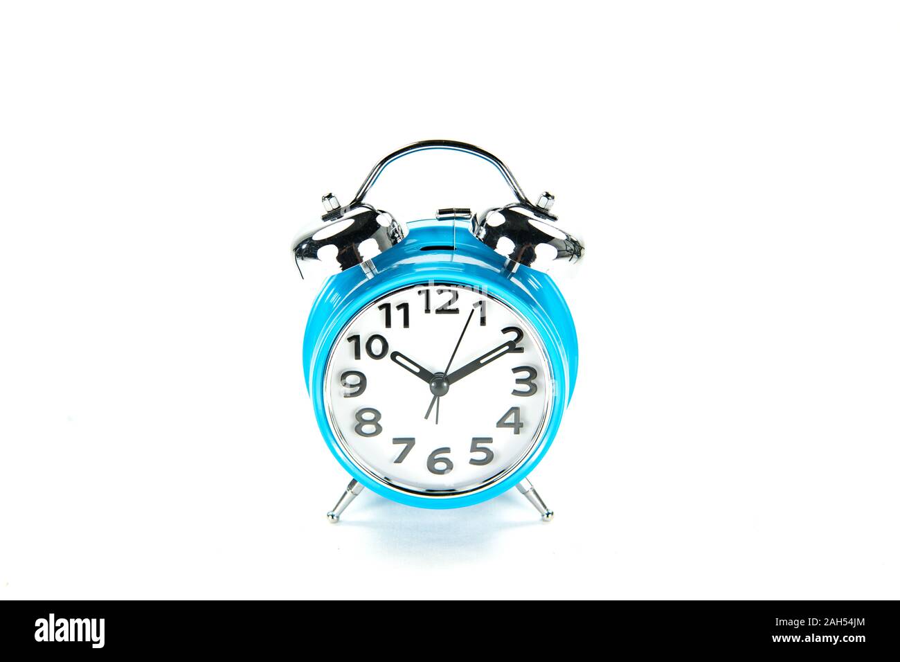 Vintage table clock with bell, light blue color, isolated on white ...