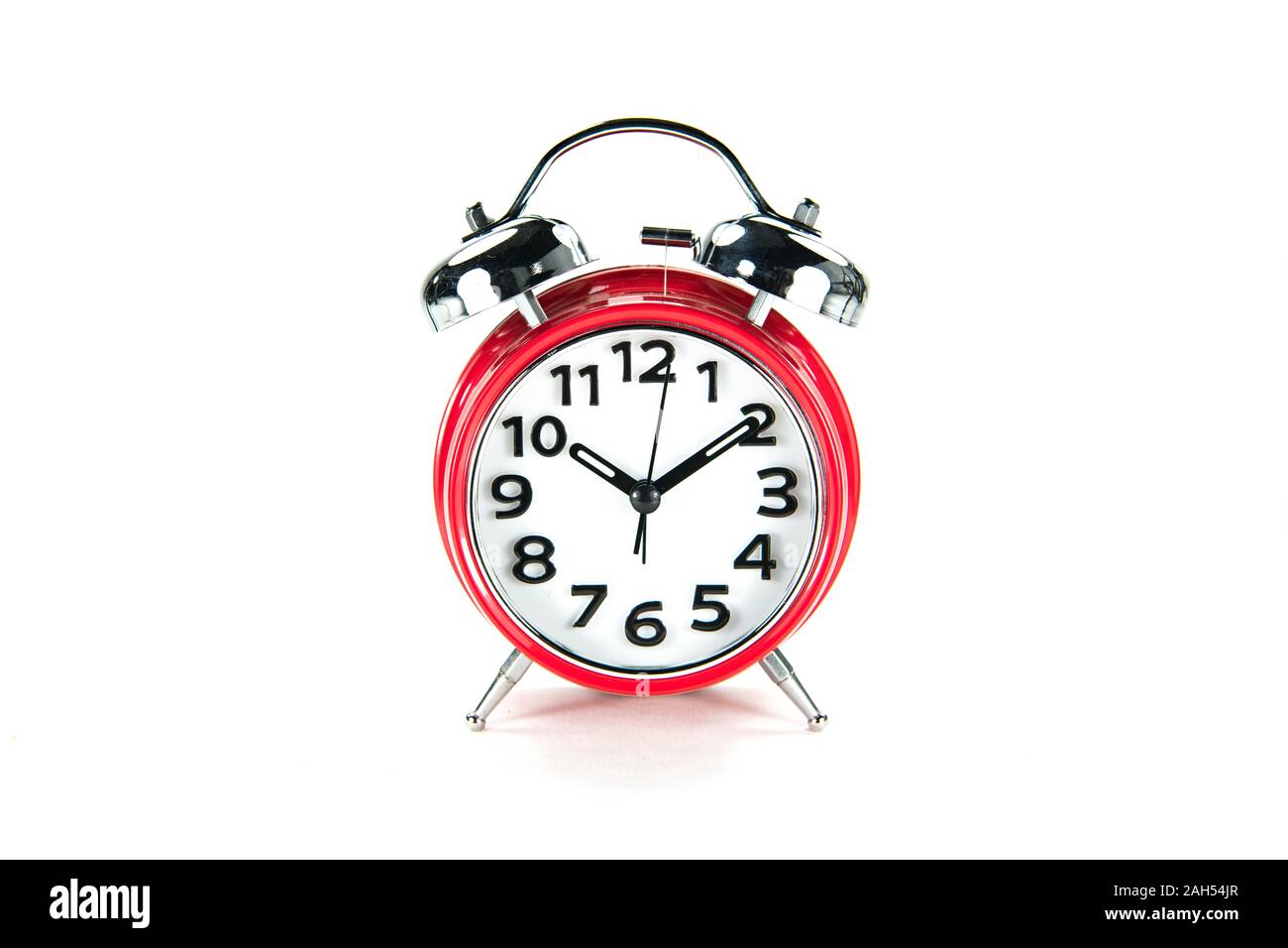 Vintage table clock with bell, red color, isolated on white bacground ...