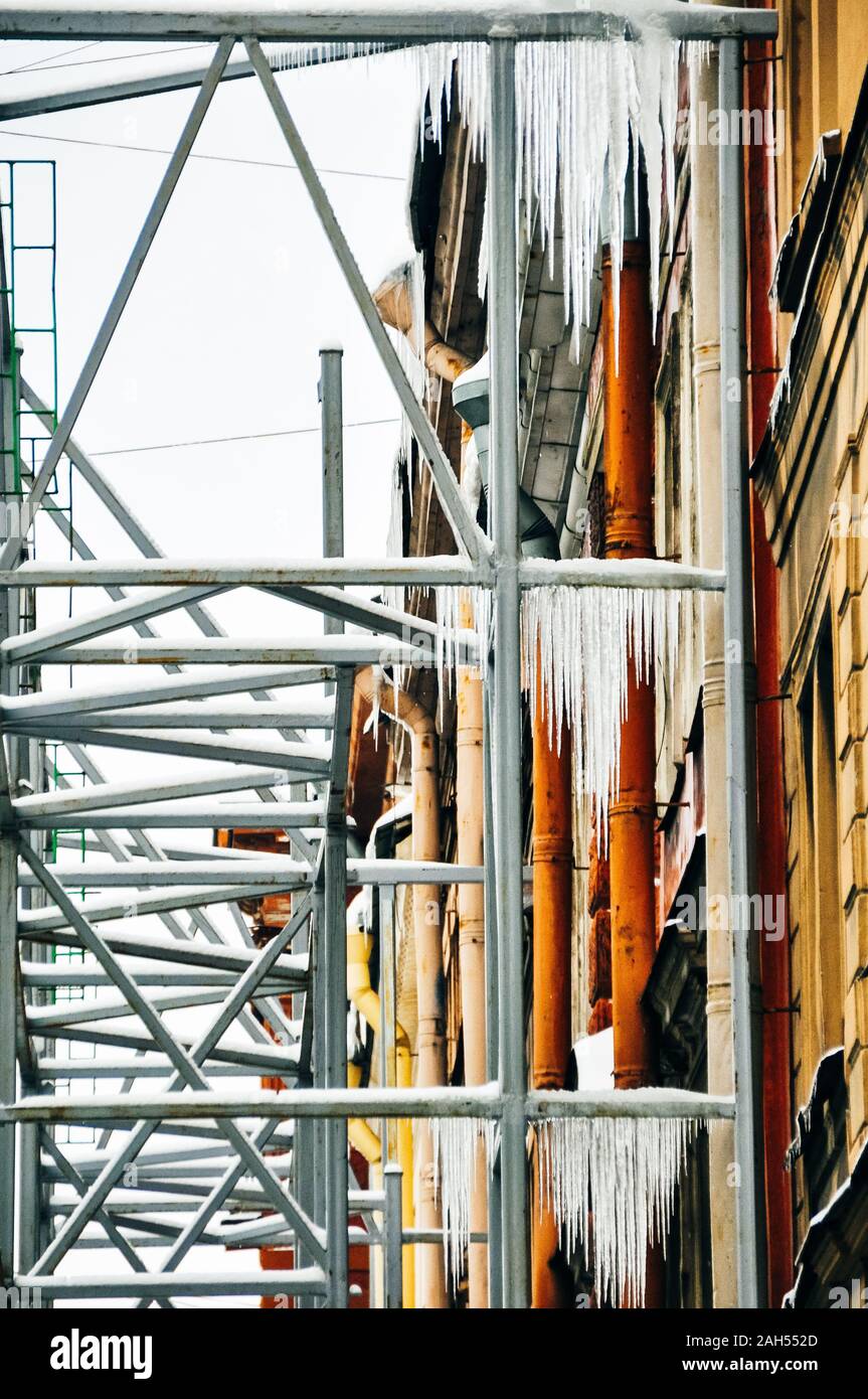 Dangerous step vertical ladder covered with icicles Stock Photo - Alamy