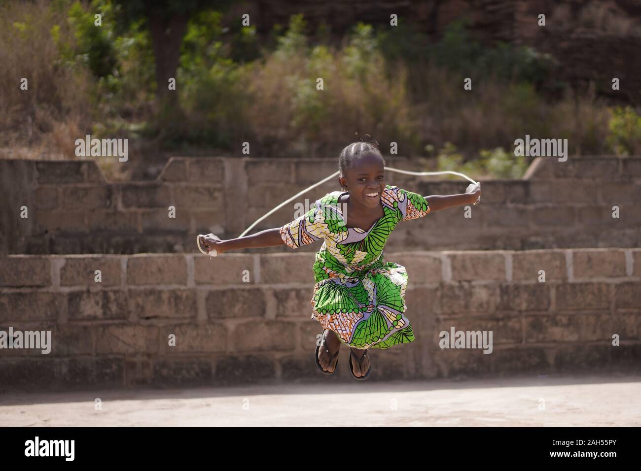 Little girl jumping rope hi-res stock photography and images - Alamy