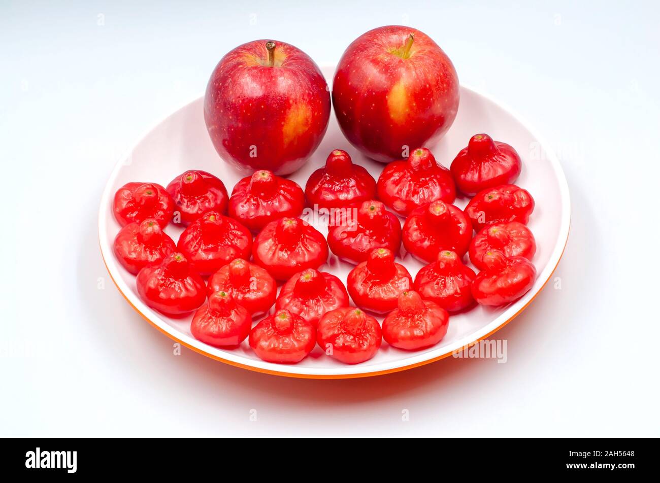 Dish of fresh rose apples and apples isolated on white background Stock ...