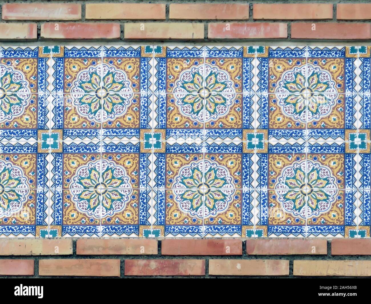 Closeup of decorative Tiles recessed in brick wall in Andalusian ...