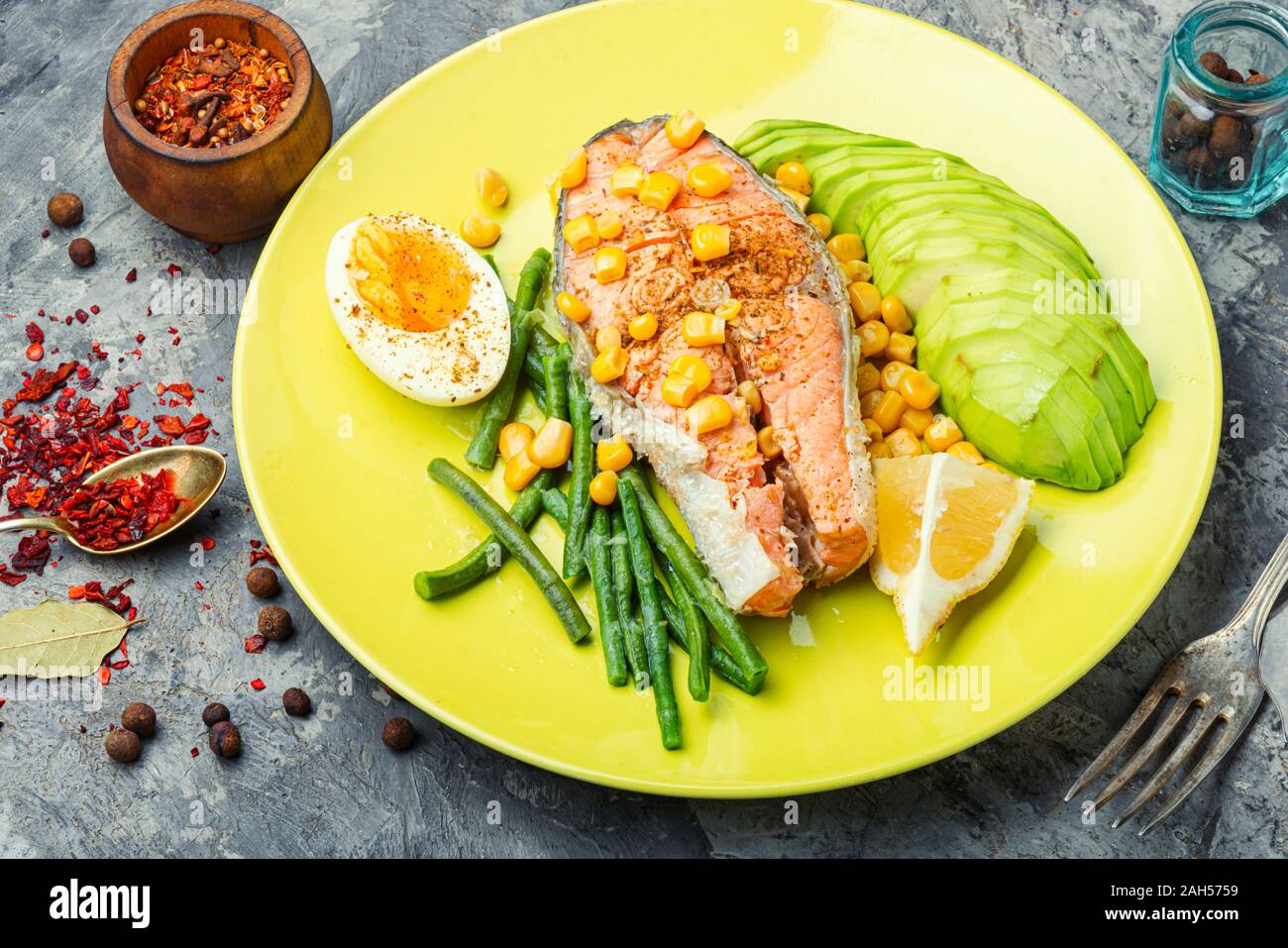 Boiled salmon or trout with avocado garnish.Diet fish Stock Photo - Alamy