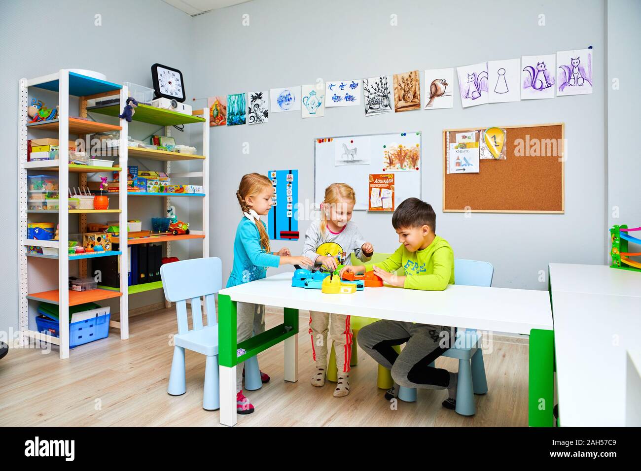 Cartoon happy boy playing table hi-res stock photography and images - Alamy