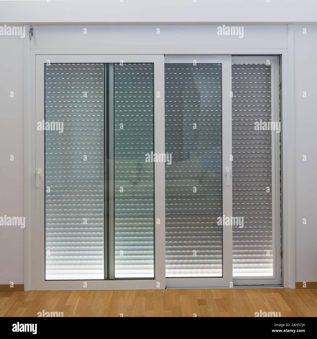 Aluminum sliding door with fly screen and rolling shutter Stock Photo ...