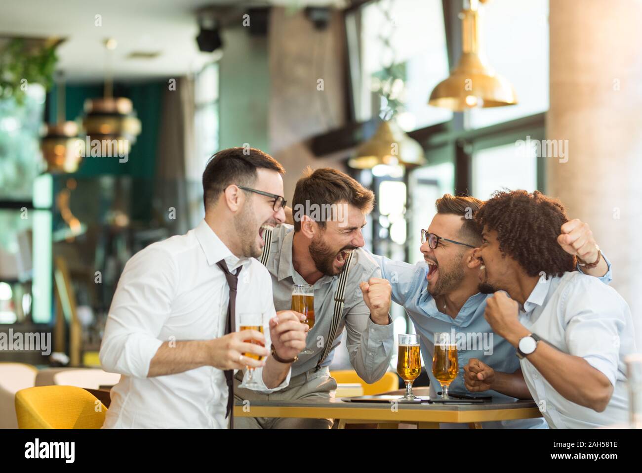 Celebrating good business cooperation at the bar Stock Photo - Alamy