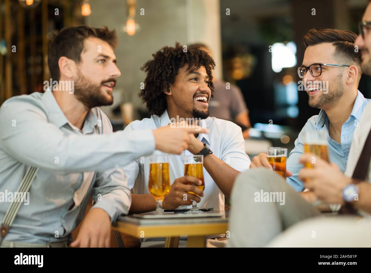Celebrating good business cooperation at the bar Stock Photo - Alamy