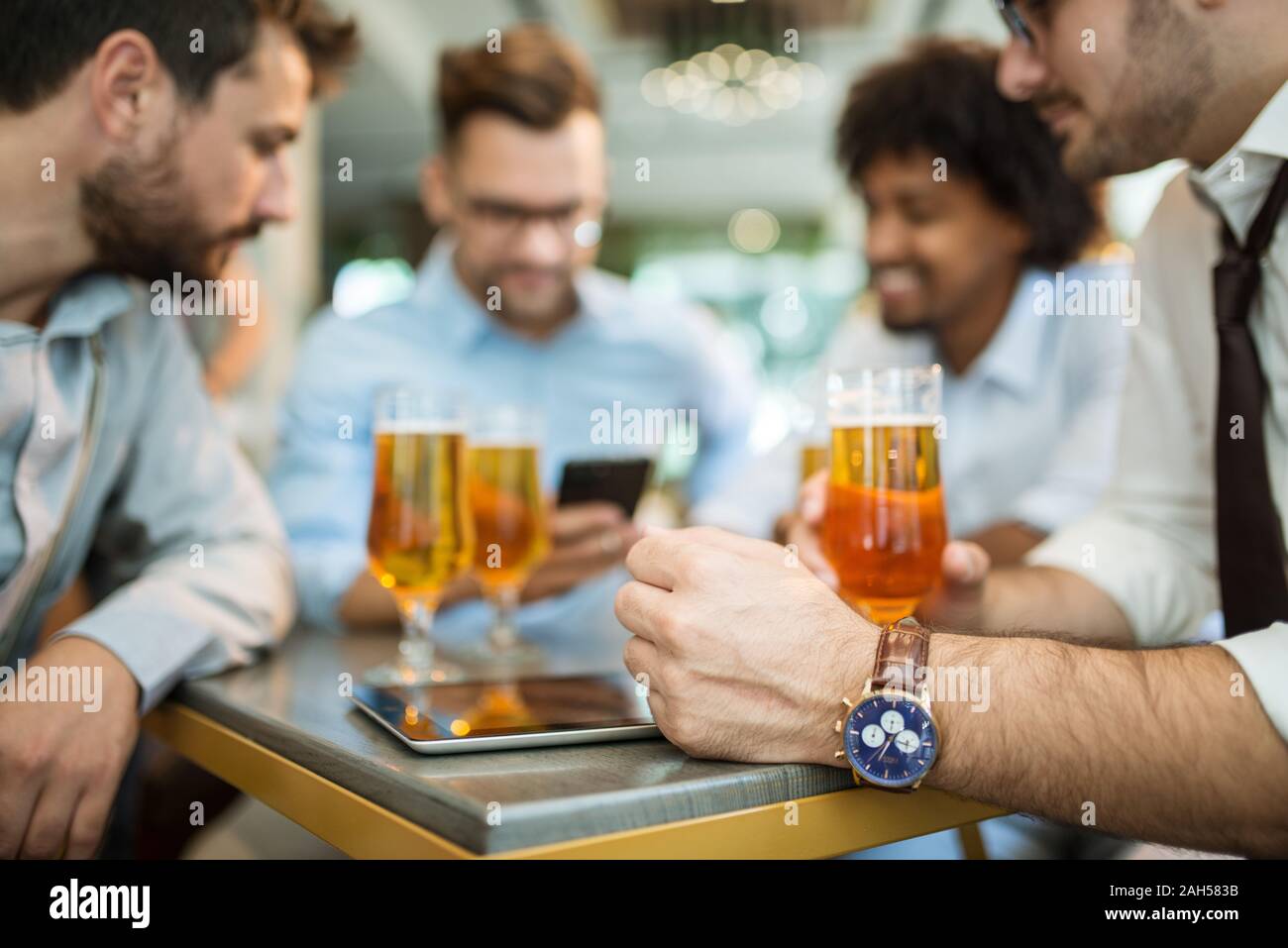 Celebrating good business cooperation at the bar Stock Photo - Alamy